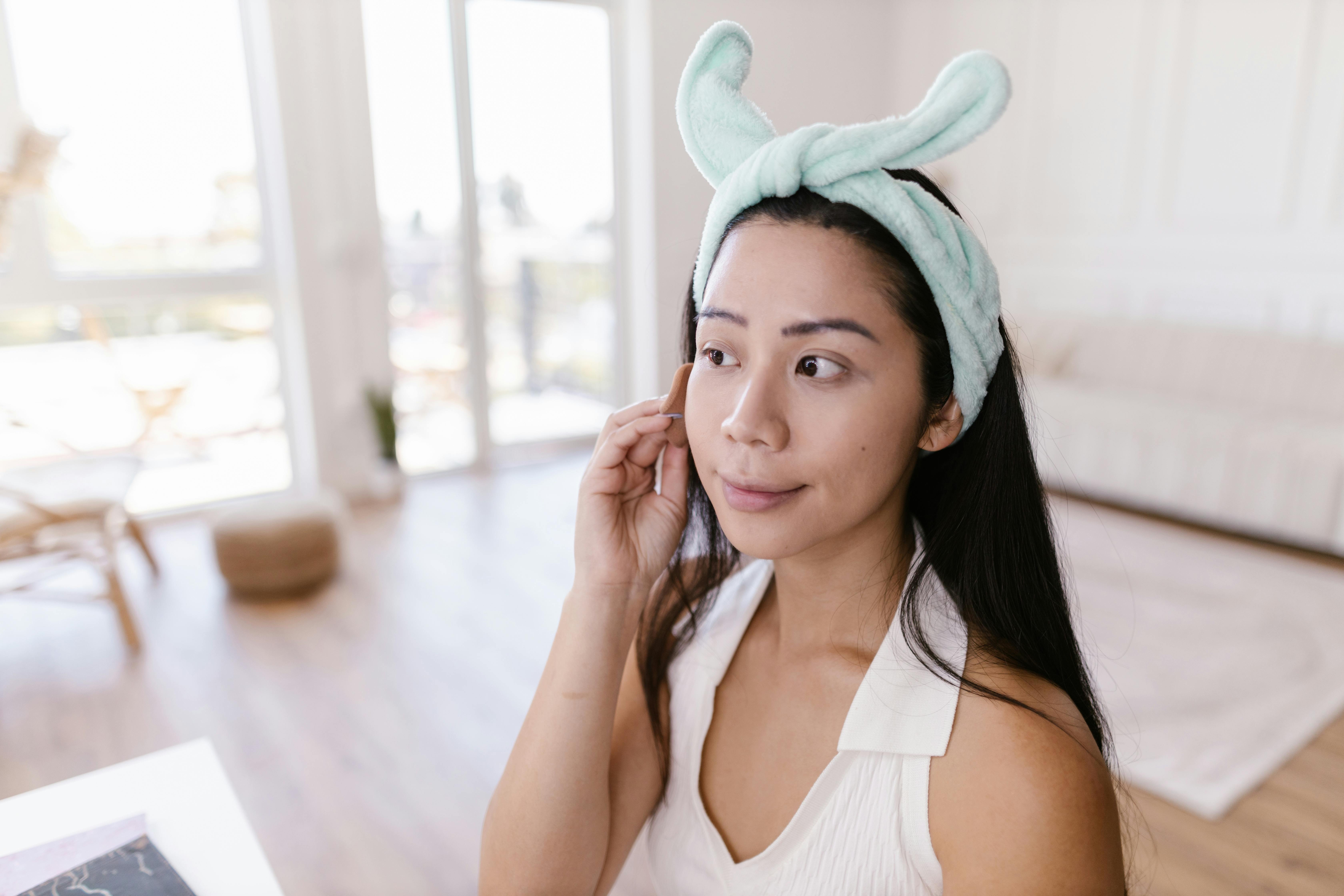 Woman Using Powder Puff · Free Stock Photo
