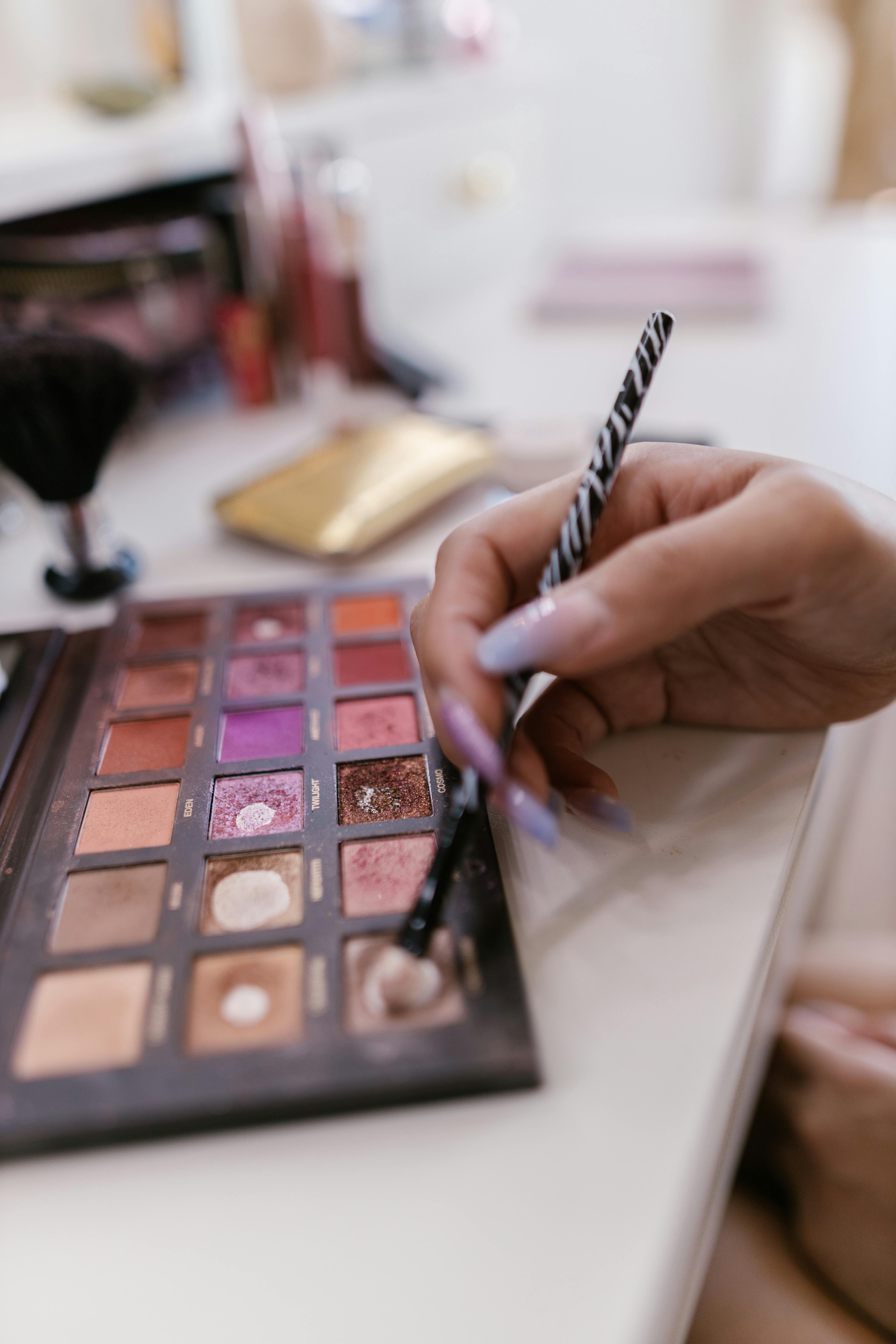 Close up of Woman Using Eyeshadow Palette · Free Stock Photo