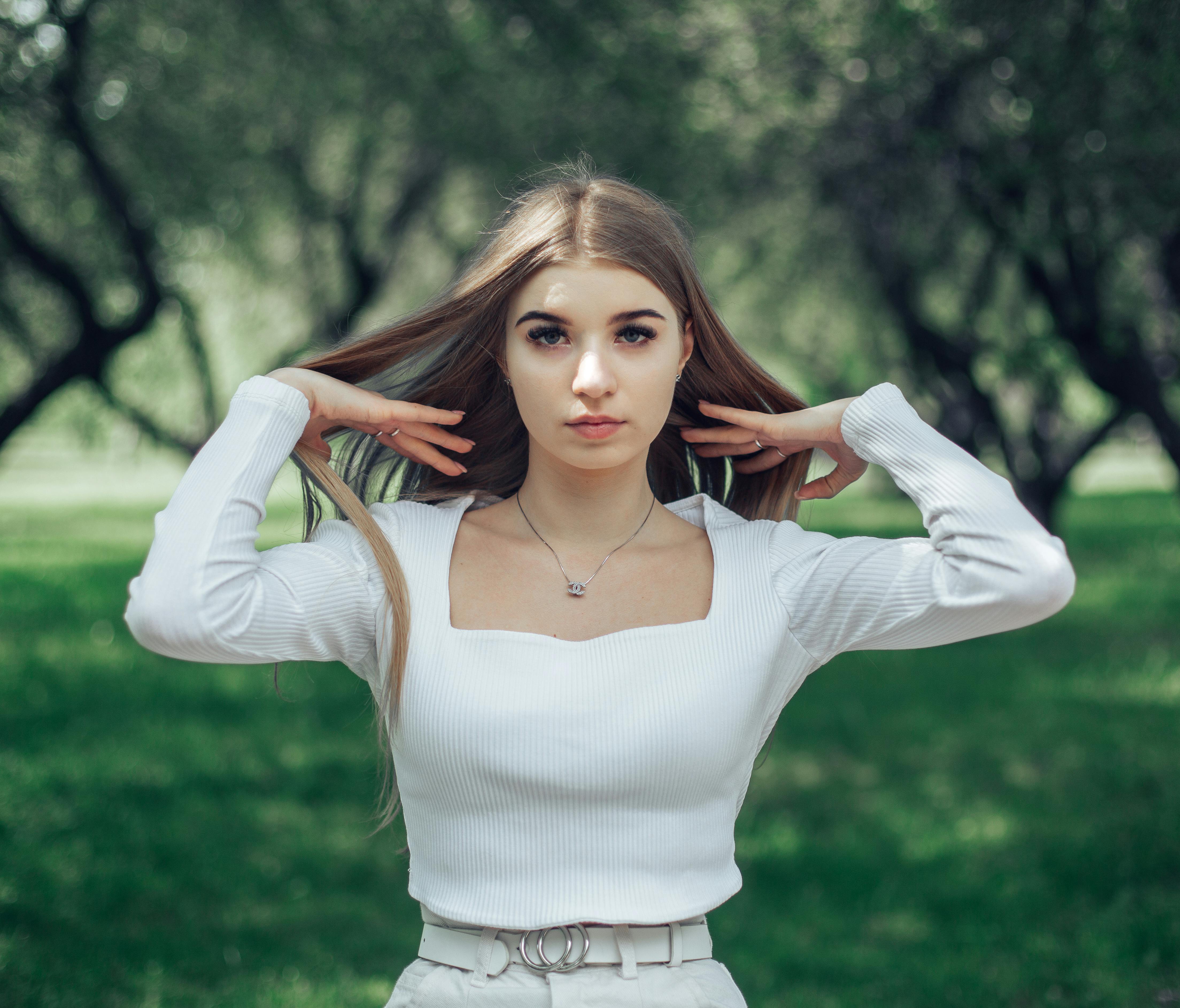 A Pretty Woman in White Long Sleeves · Free Stock Photo