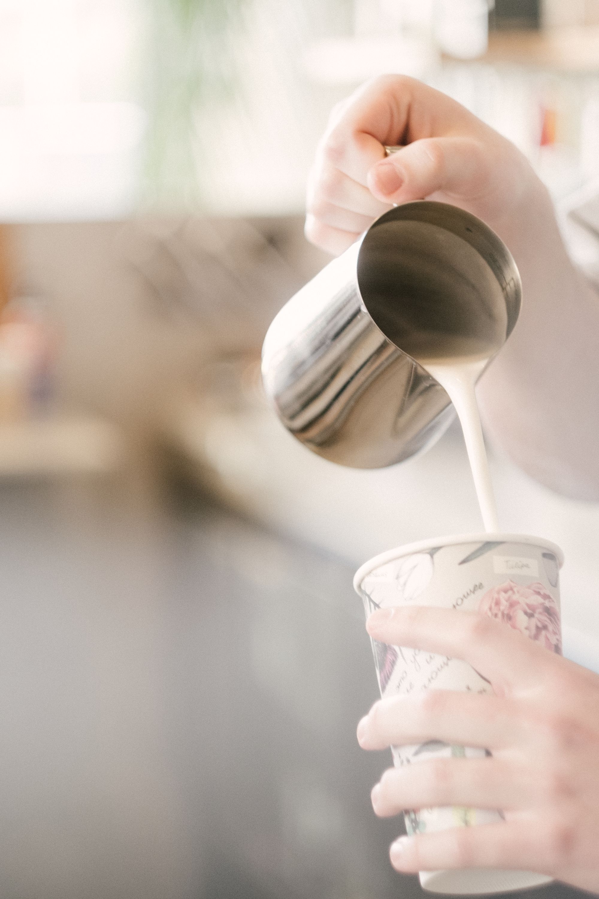 A Person Pouring Liquid in the Measuring Cup · Free Stock Photo