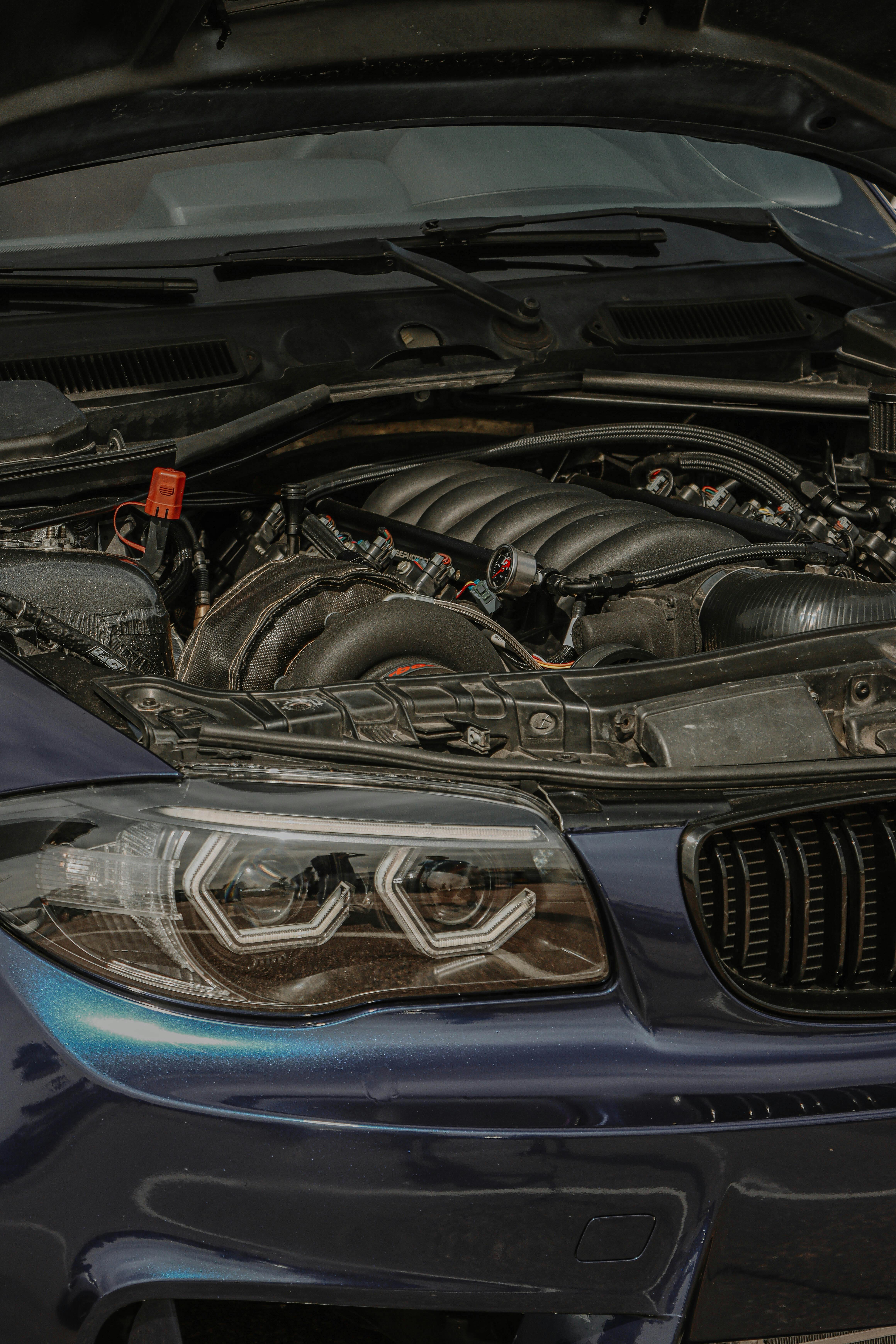 Photo of a Car Engine Bay and Headlight · Free Stock Photo