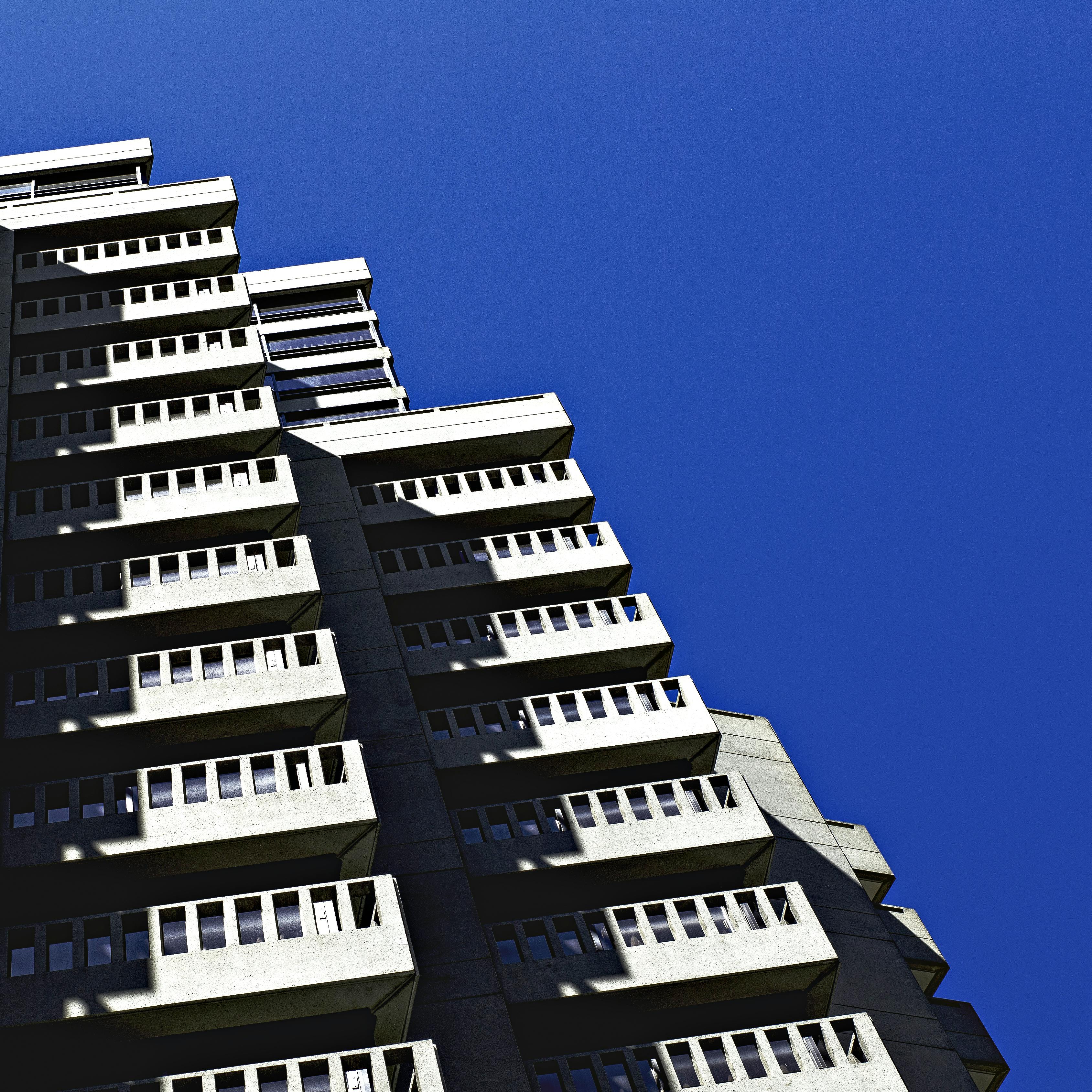 Gray High-rise Building Under Blue Sky · Free Stock Photo