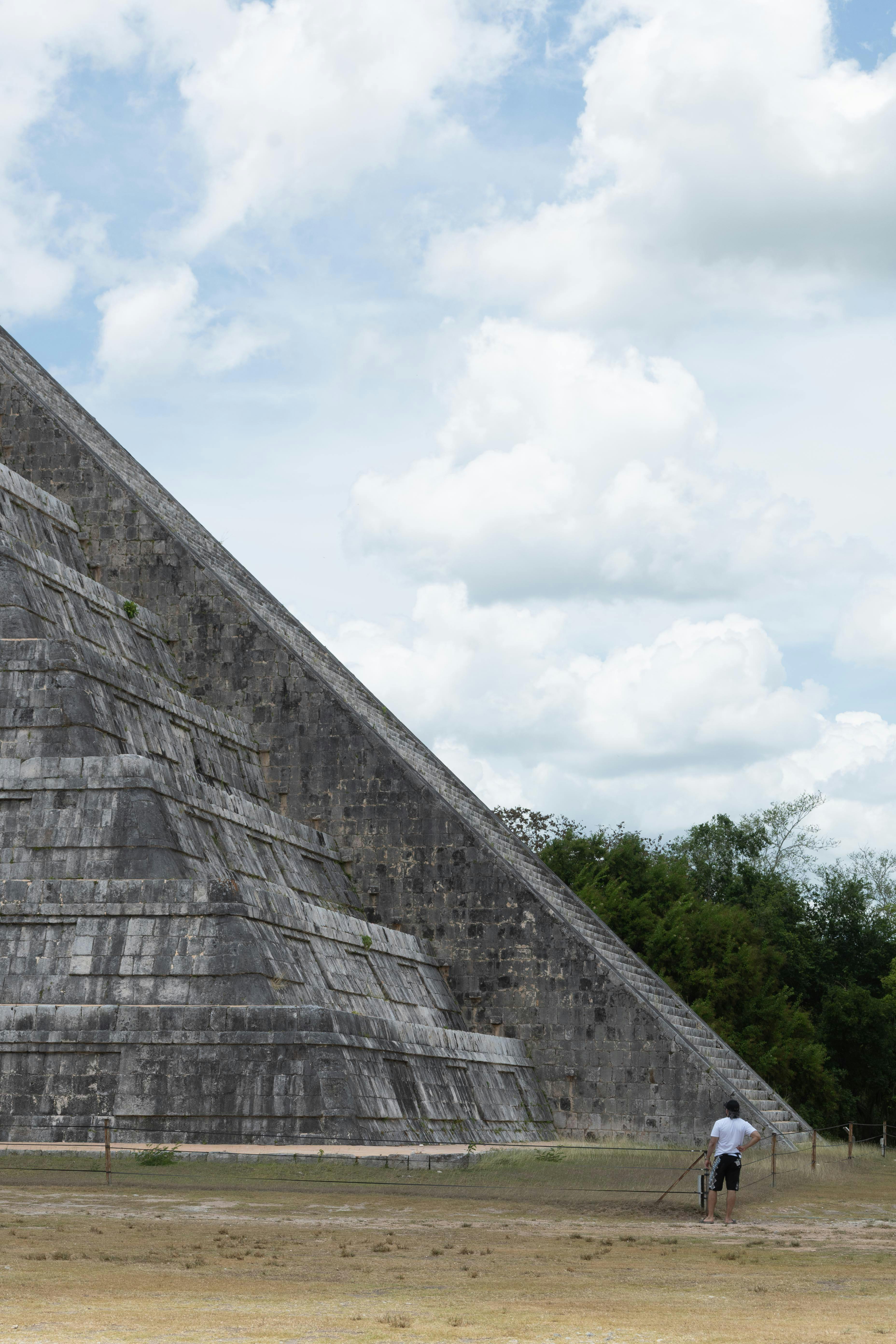 A Man Walking Beside the Pyramid · Free Stock Photo