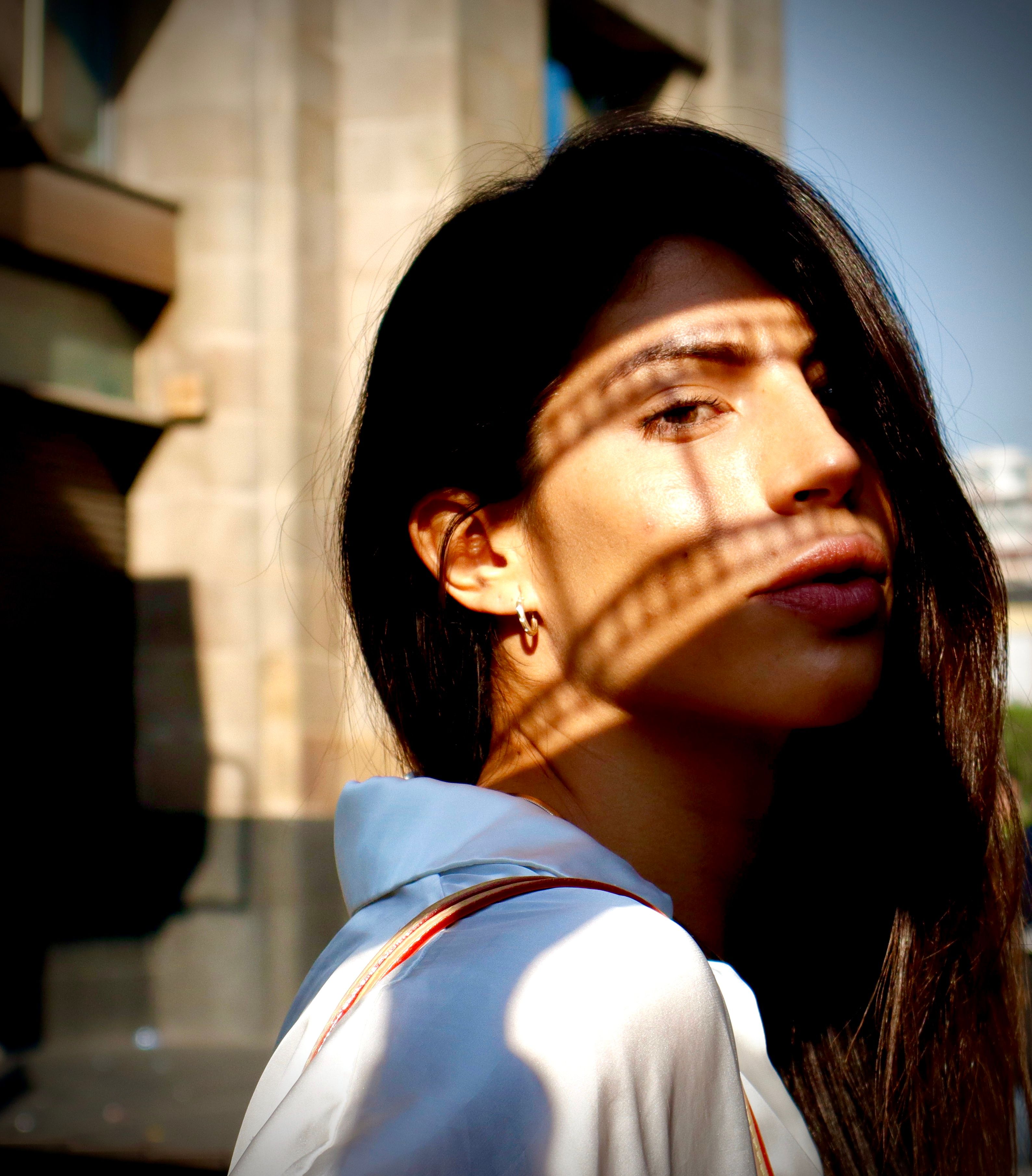 Pretty Woman Looking Over Her Shoulder · Free Stock Photo