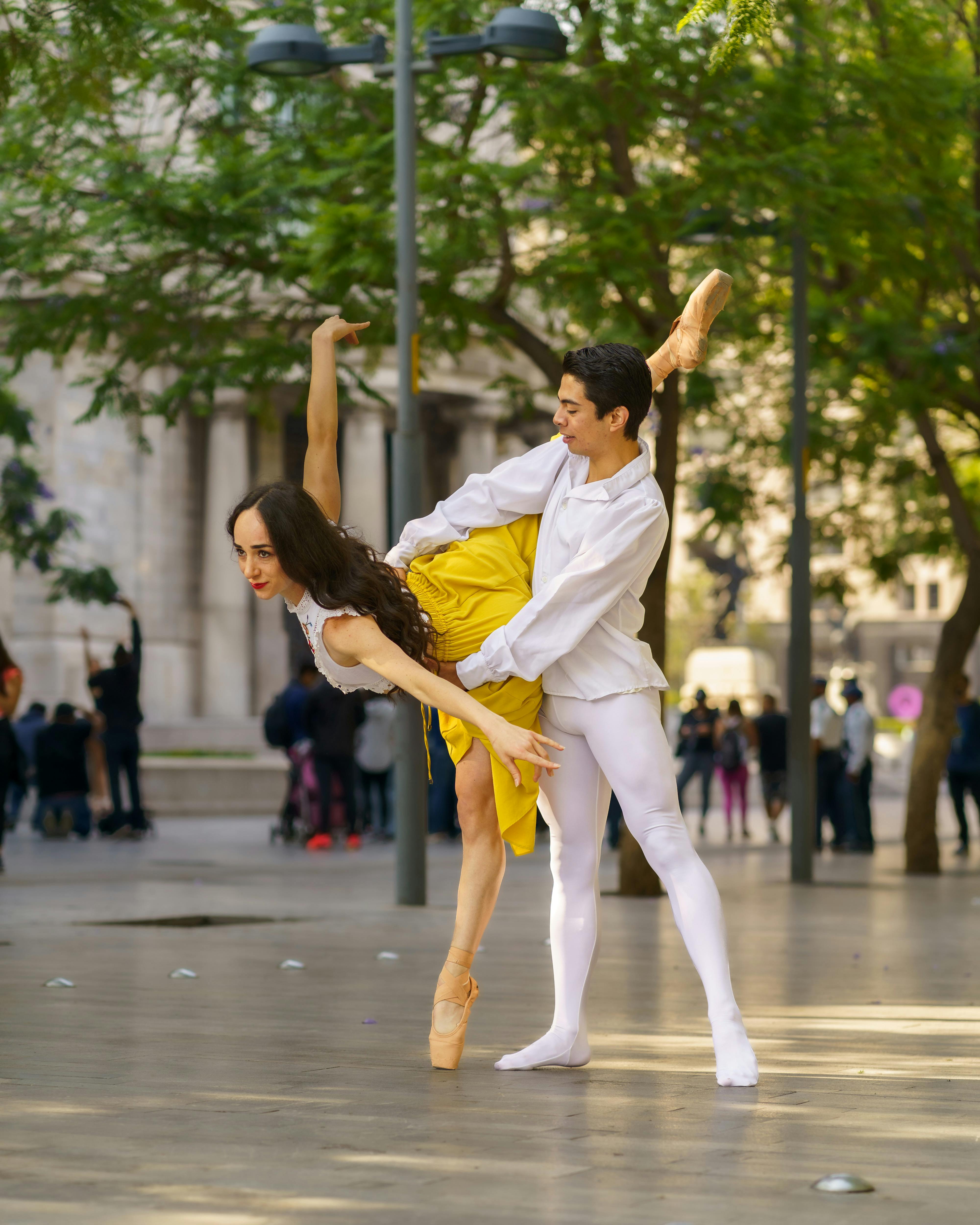 Man in White Shirt and Pants Dancing on the Street · Free Stock Photo