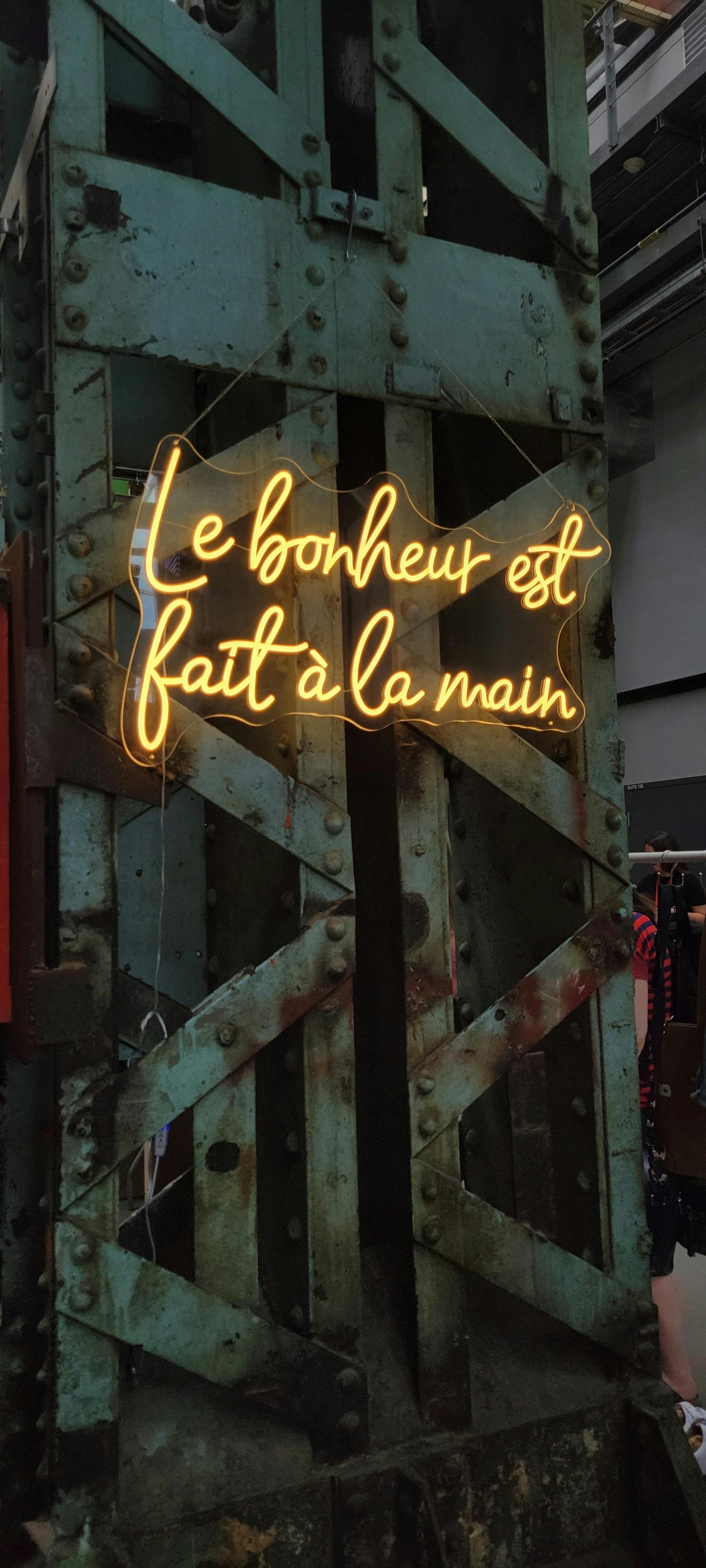 Neon Signage on Steel Columns · Free Stock Photo