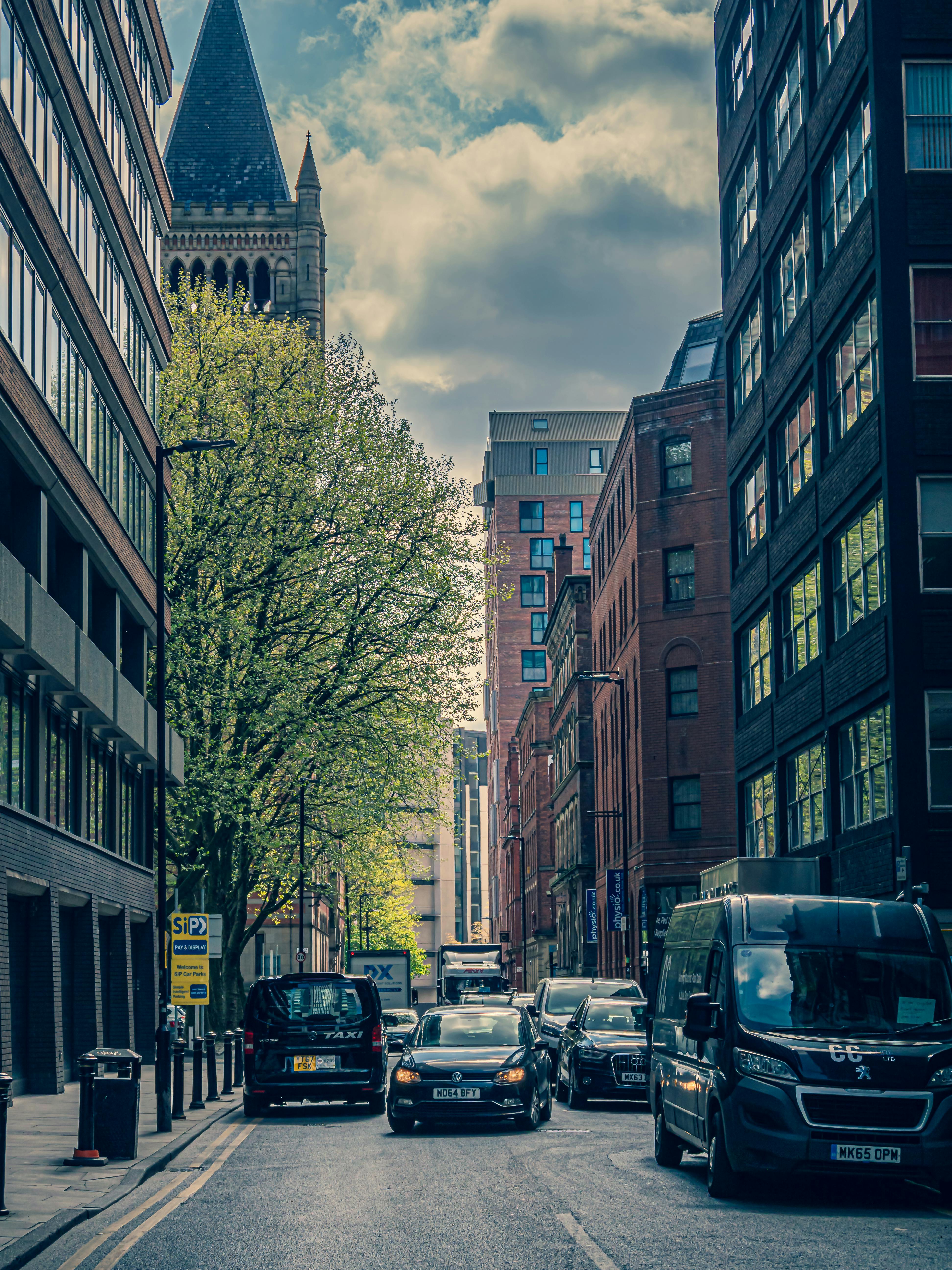 Traffic Between City Buildings · Free Stock Photo