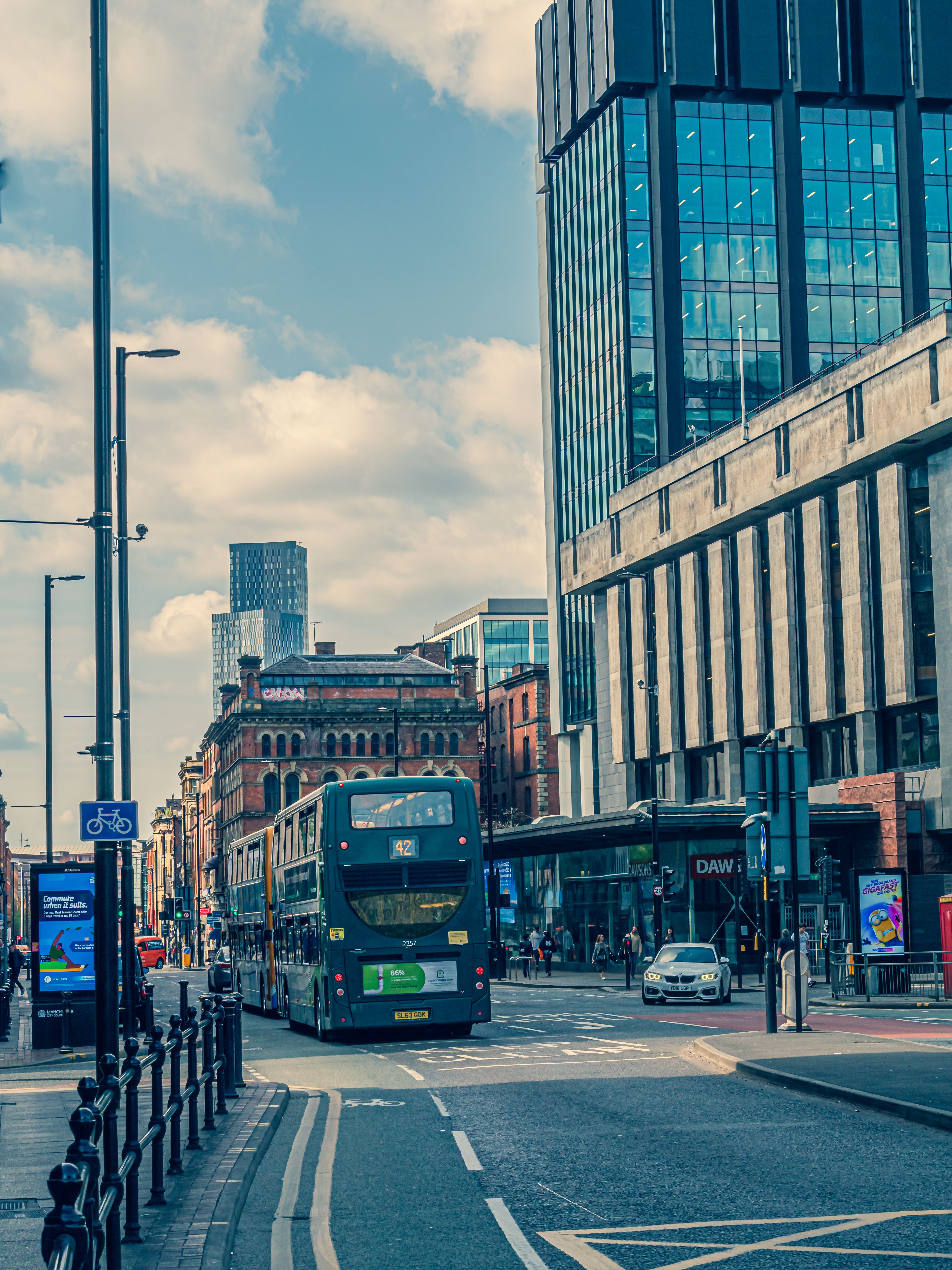 Bus Driving on City Street · Free Stock Photo