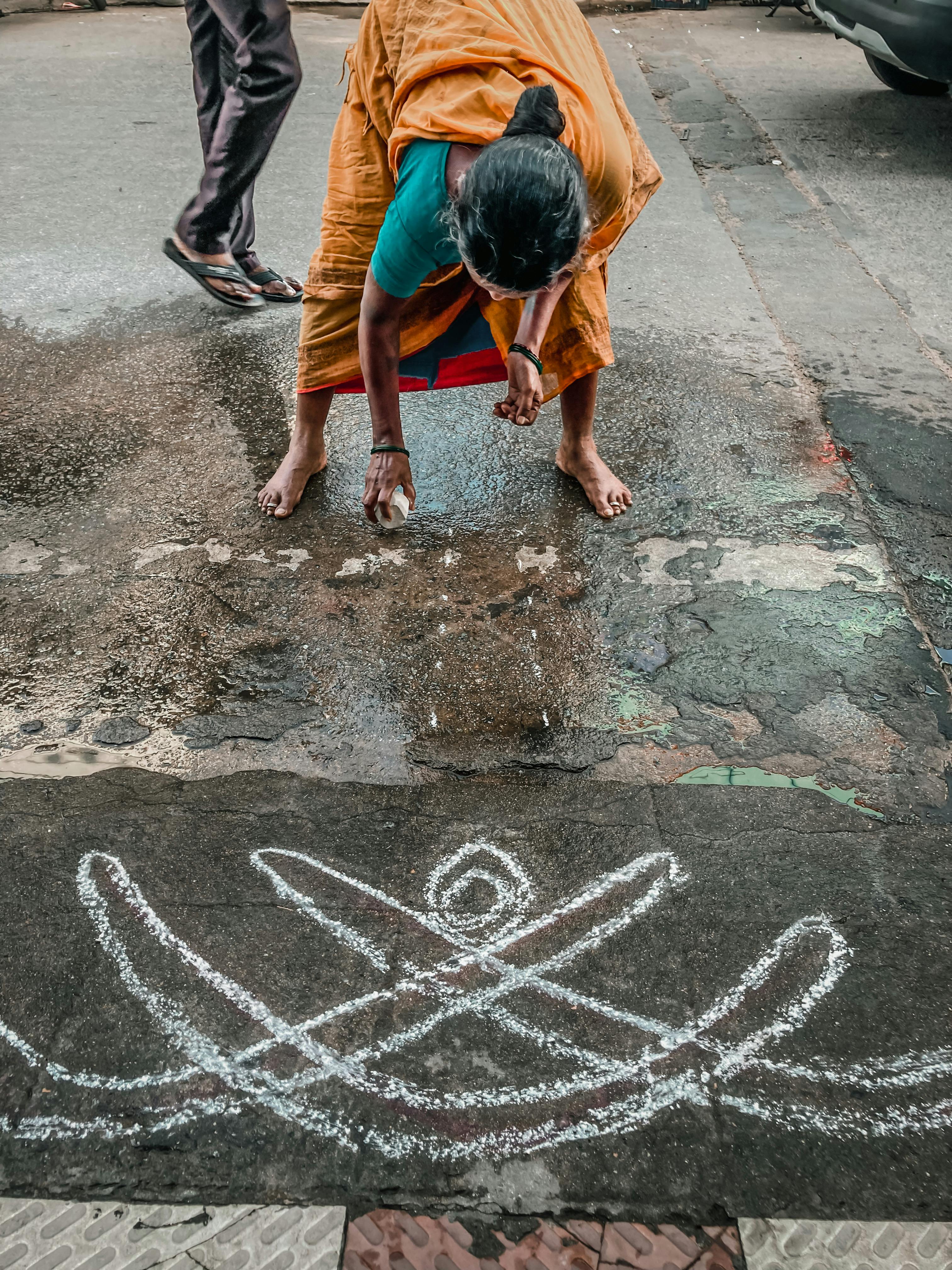 A Woman Writing on Concrete Road · Free Stock Photo