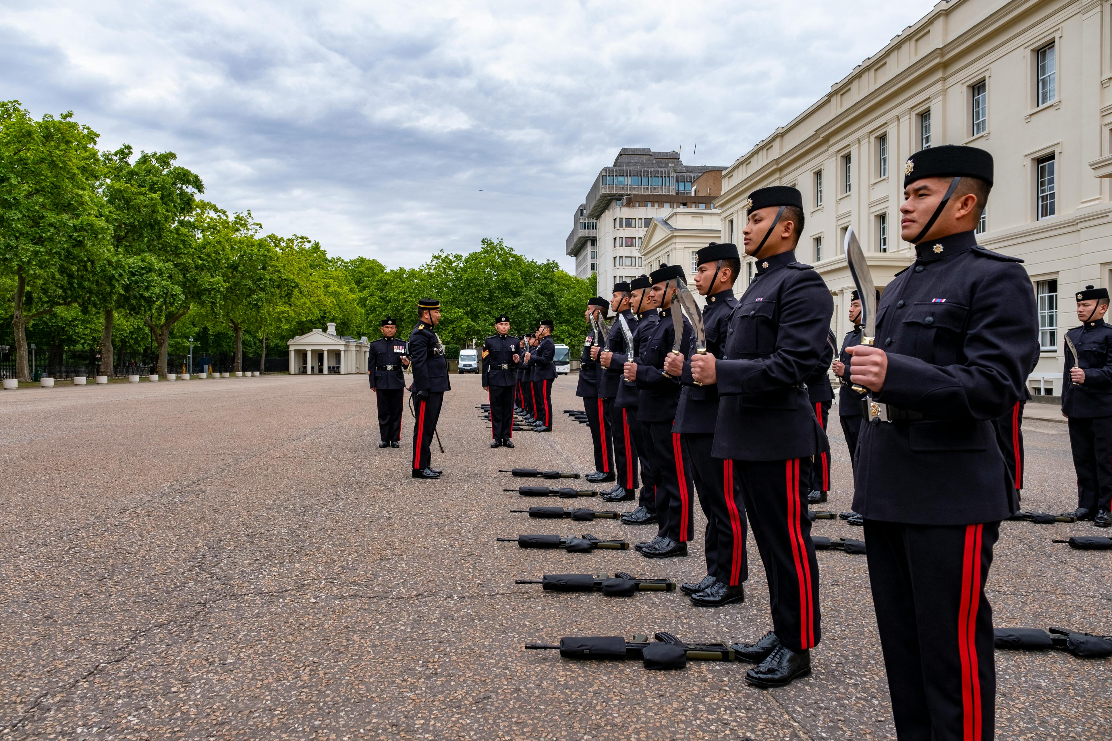Men Wearing Black and Red Uniform · Free Stock Photo