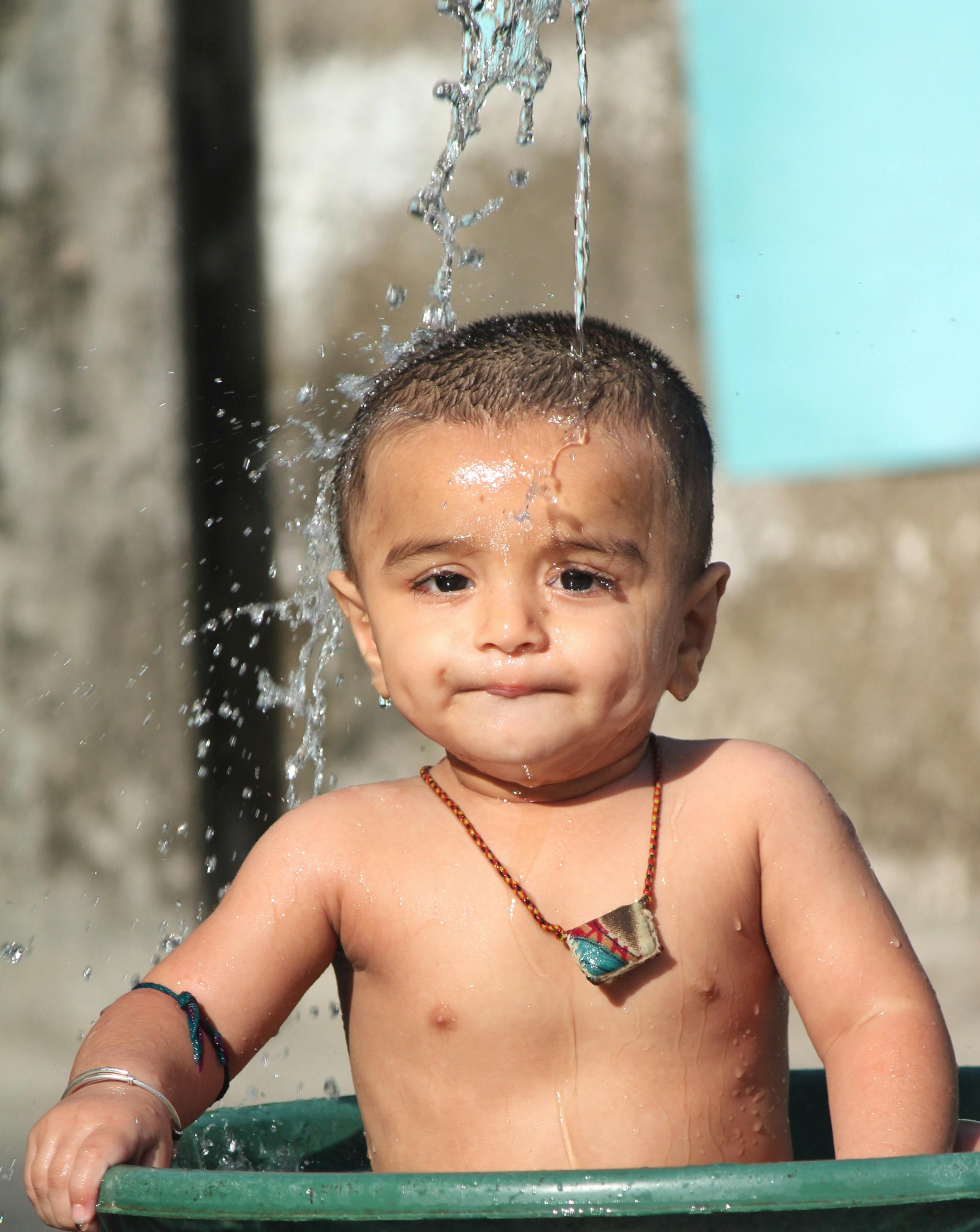 Wet Boy With Water Droplets in Slow Motion Photography · Free Stock Photo