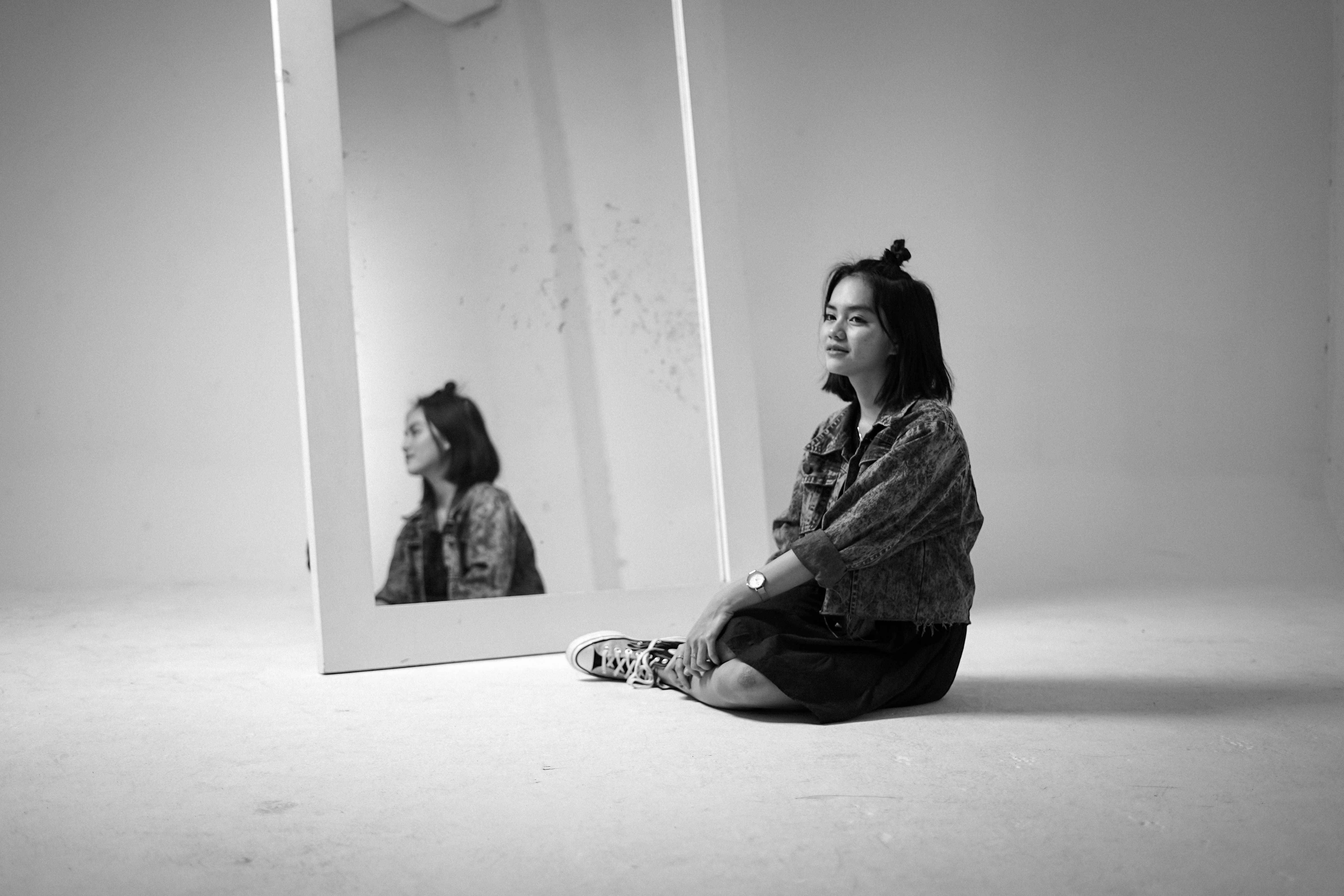 Casual Style Model Sitting by Mirror · Free Stock Photo