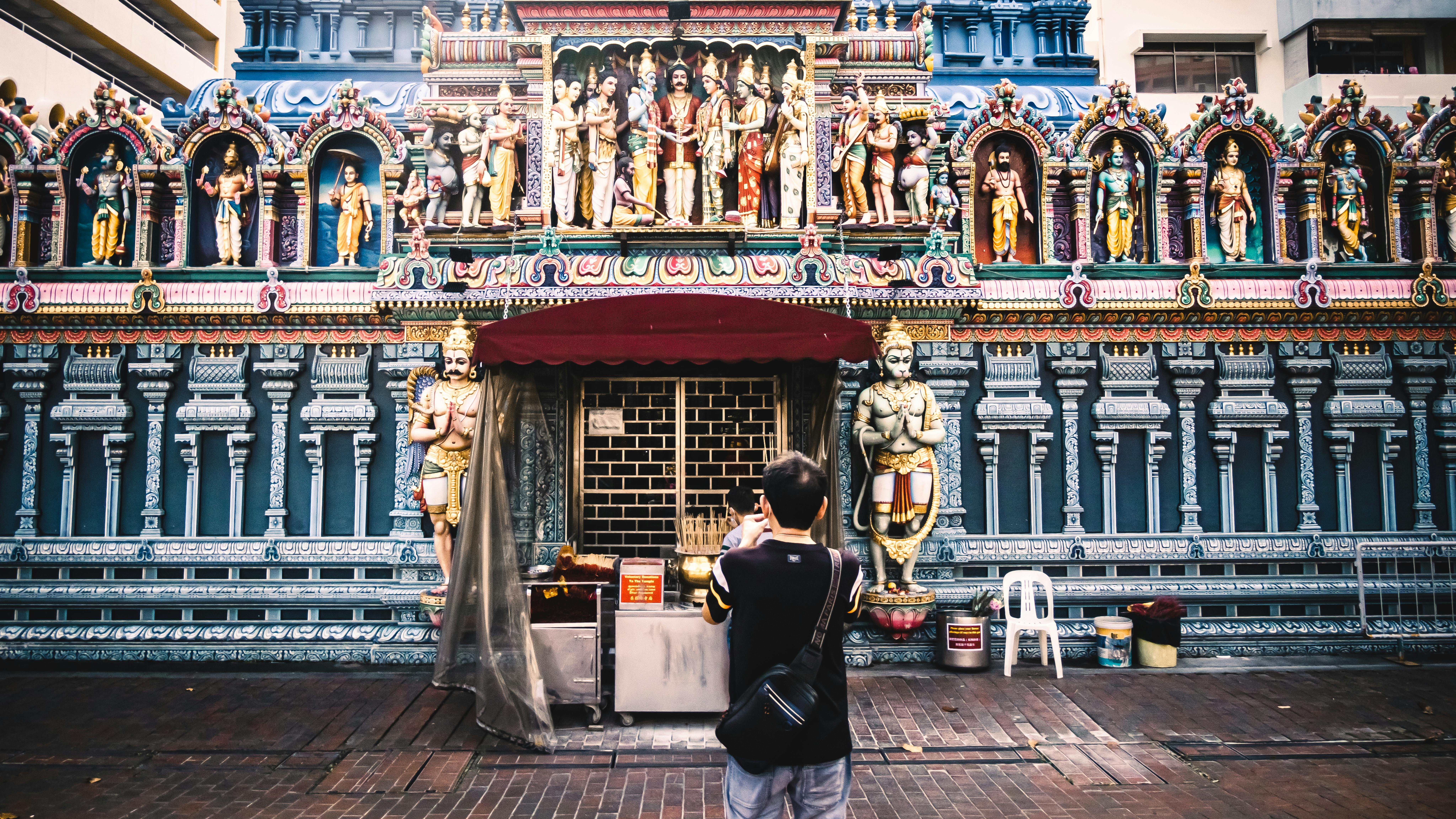 Man Standing in Front of the Temple · Free Stock Photo