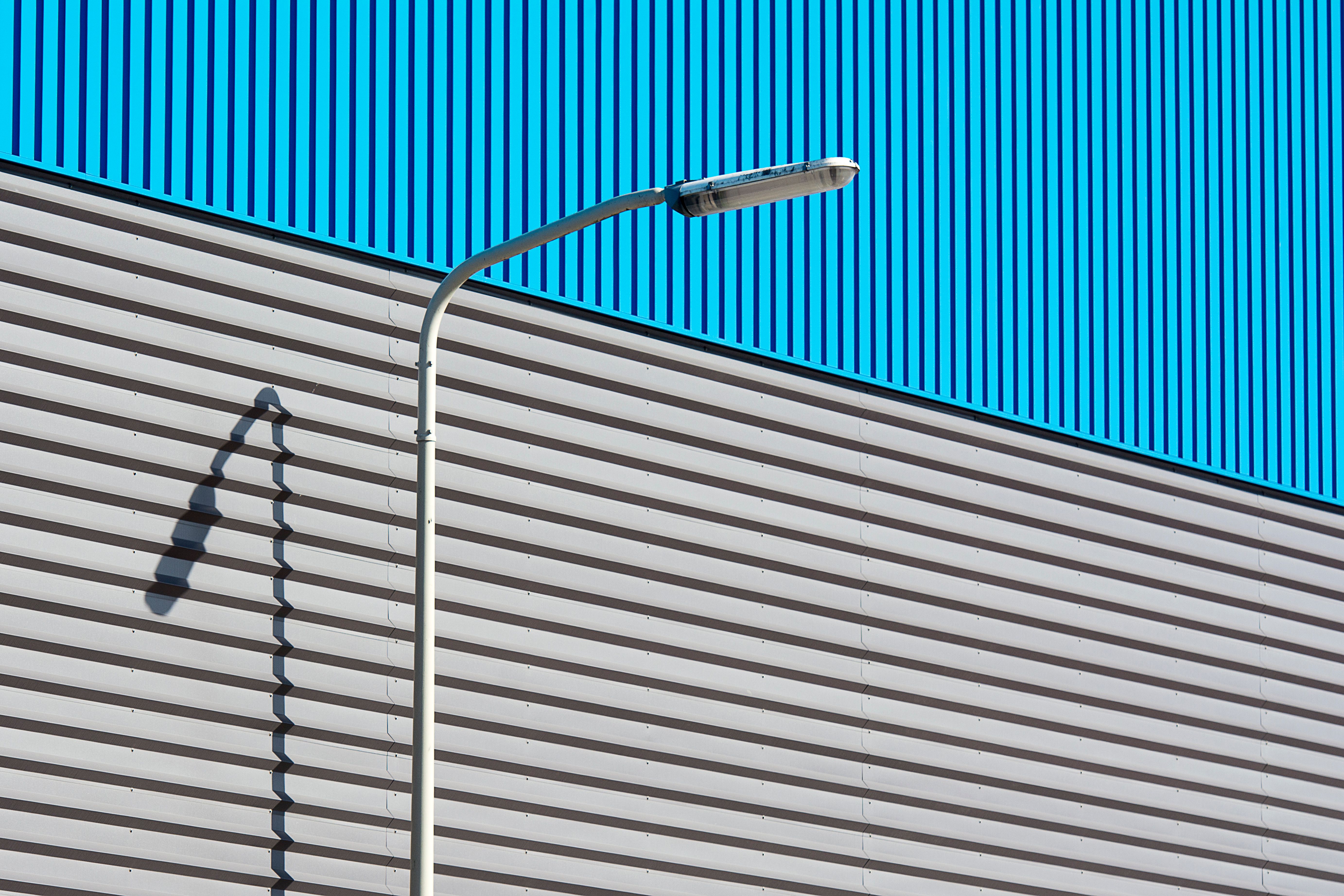 Gray Street Light Beside the Building · Free Stock Photo