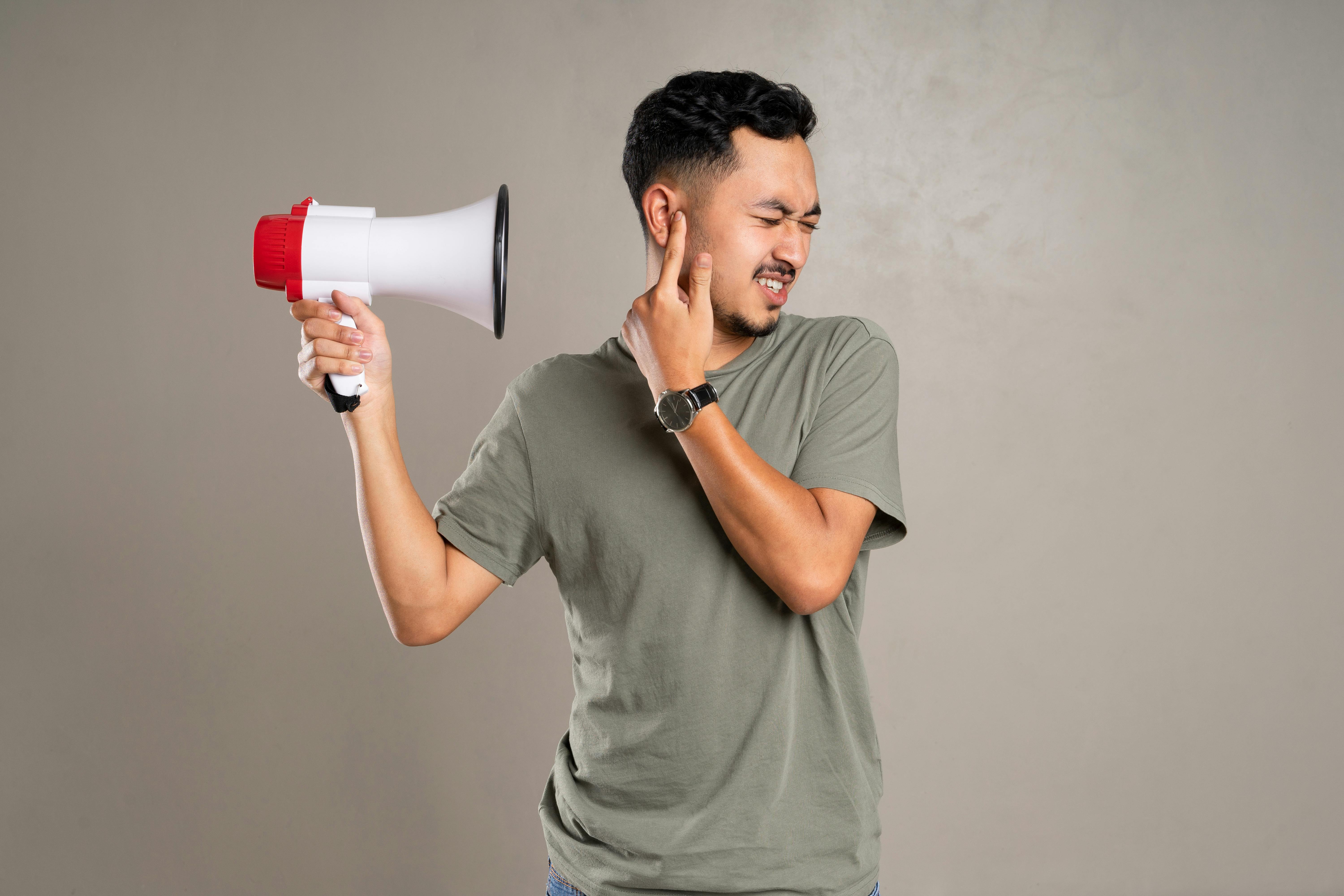 A Man Holding a Megaphone · Free Stock Photo