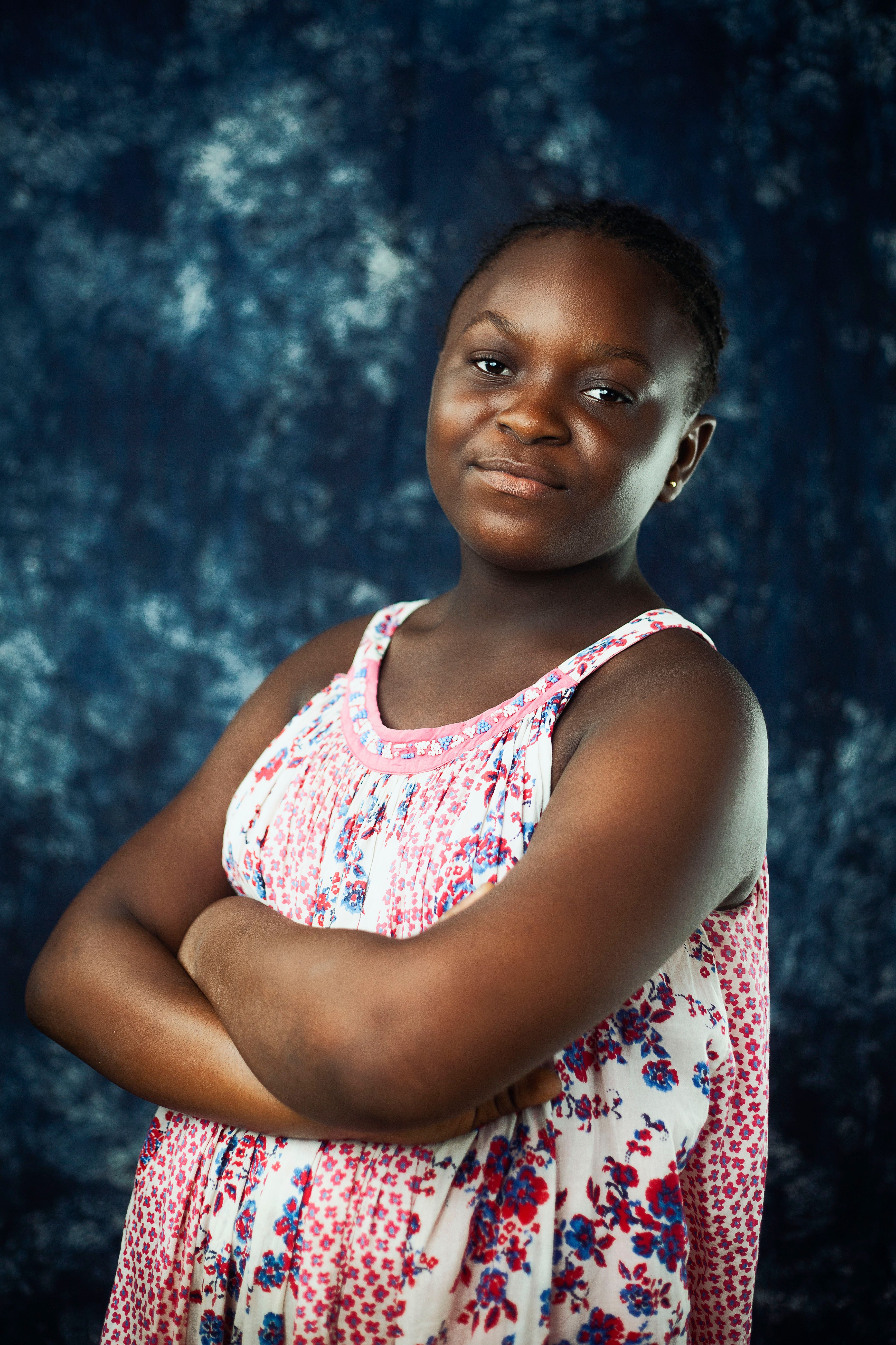 A Girl Posing with Her Arms Crossed · Free Stock Photo