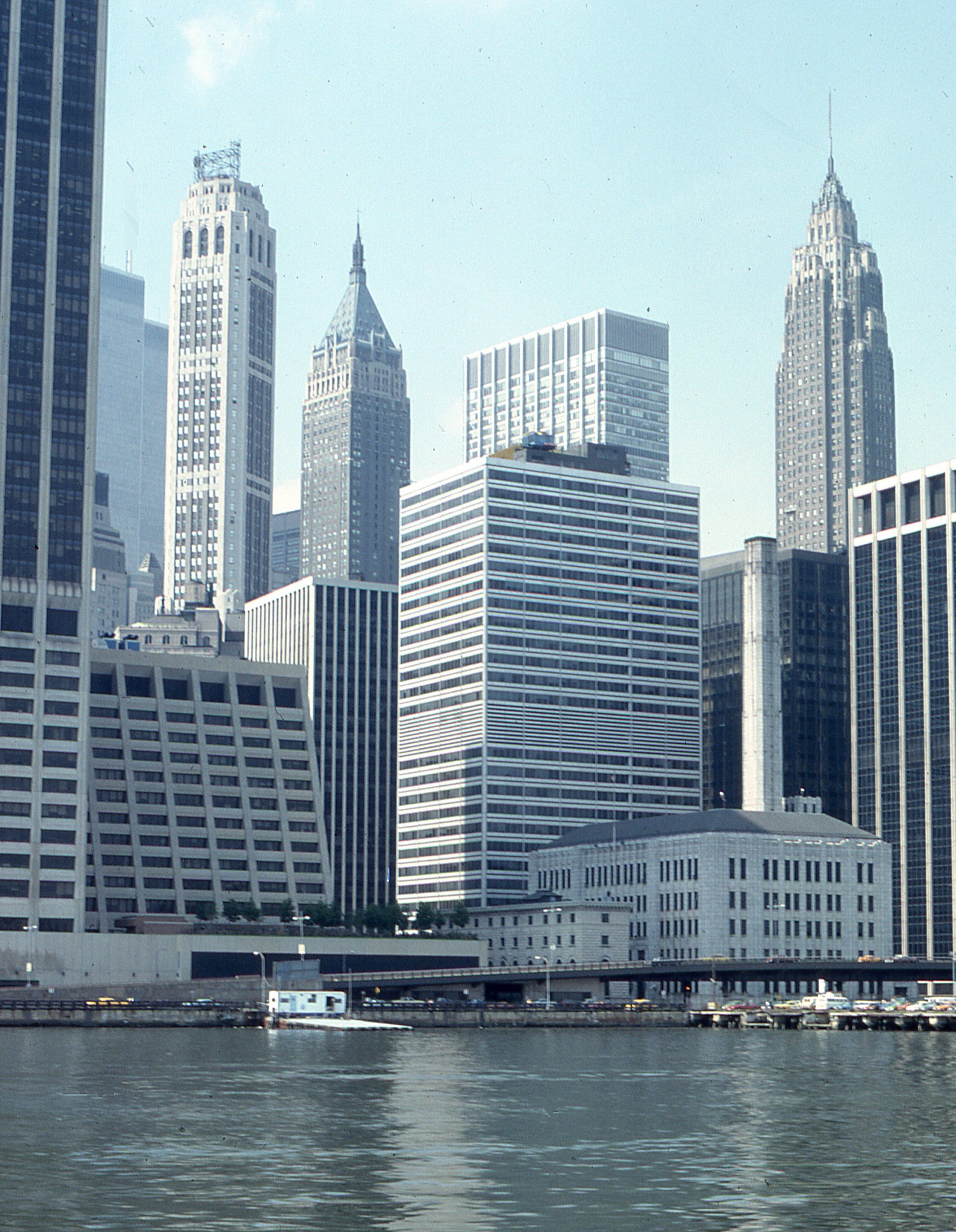 Concrete Buildings Near Body of Water · Free Stock Photo