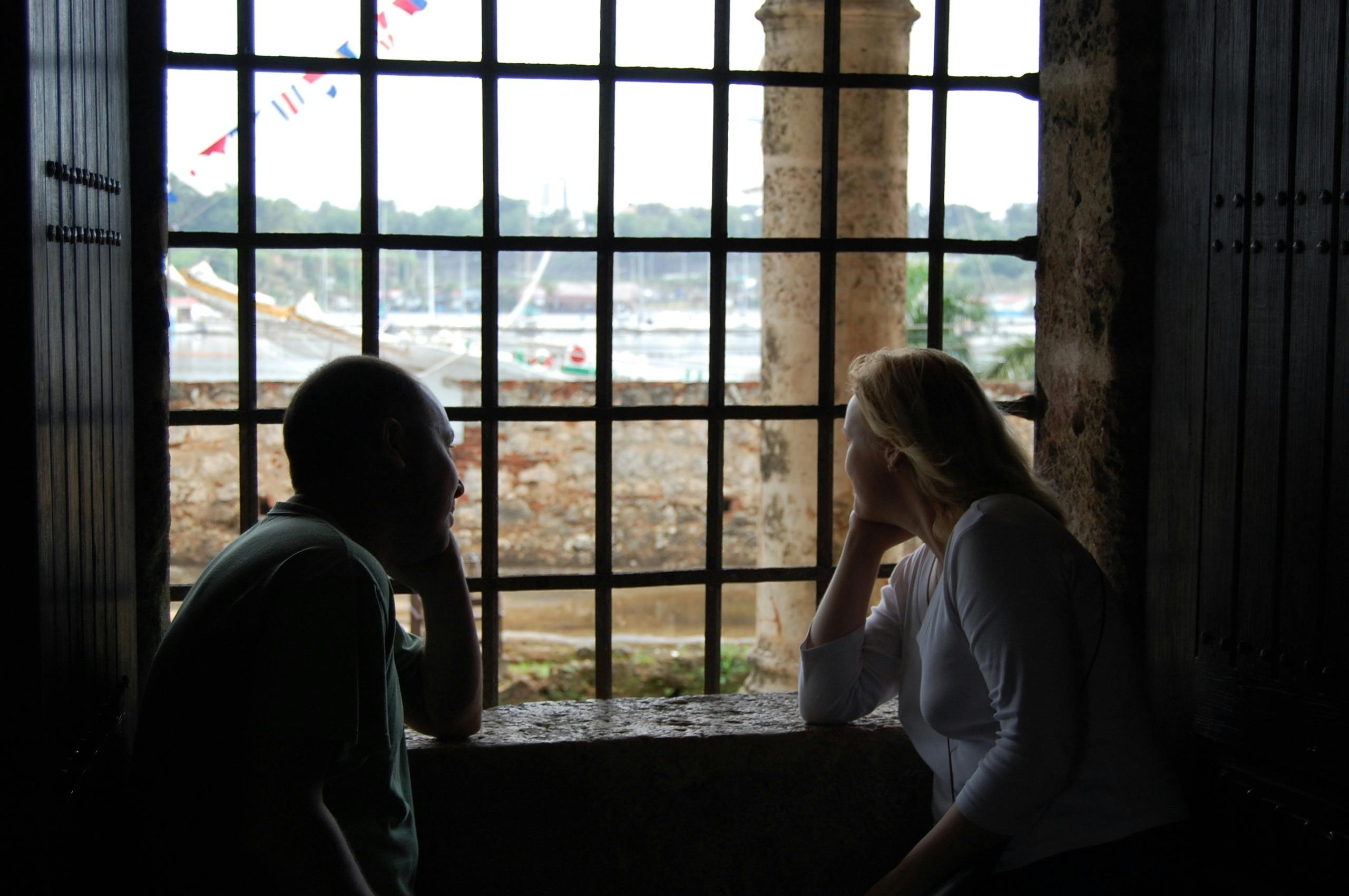 Man and Woman Standing Beside the Window · Free Stock Photo