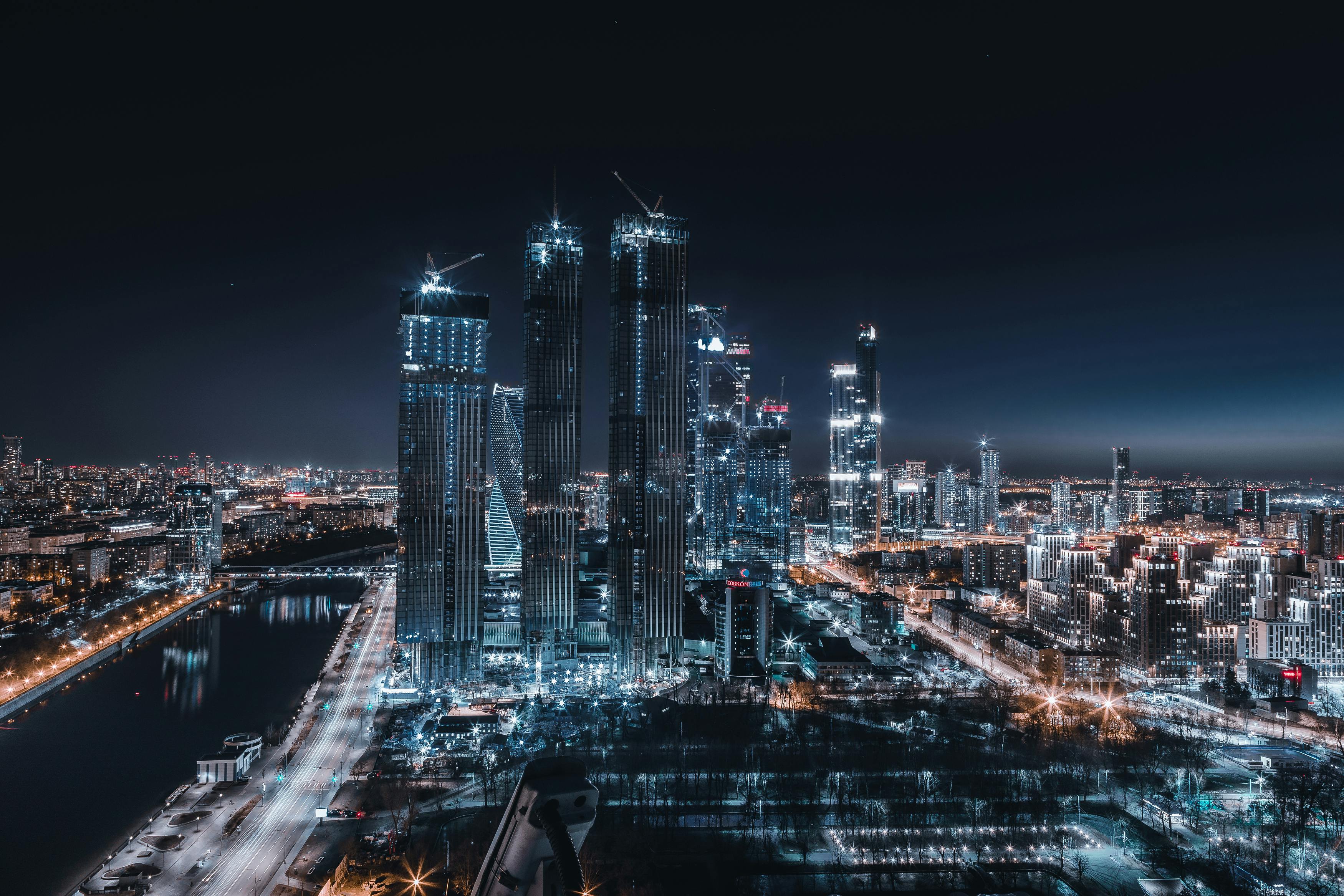 Cityscape at Night with Illuminated Skyscrapers · Free Stock Photo