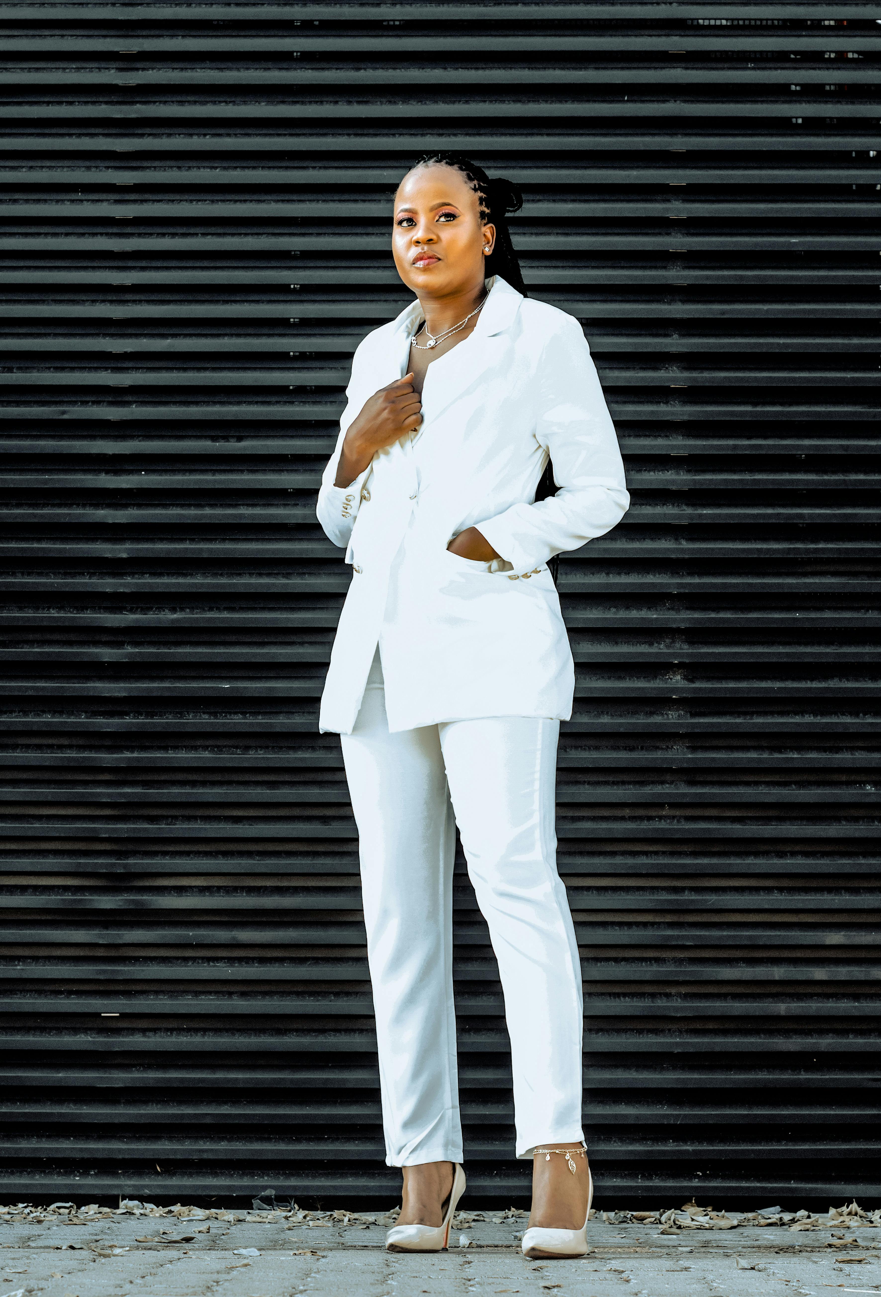 Photo of a Woman in a White Suit · Free Stock Photo