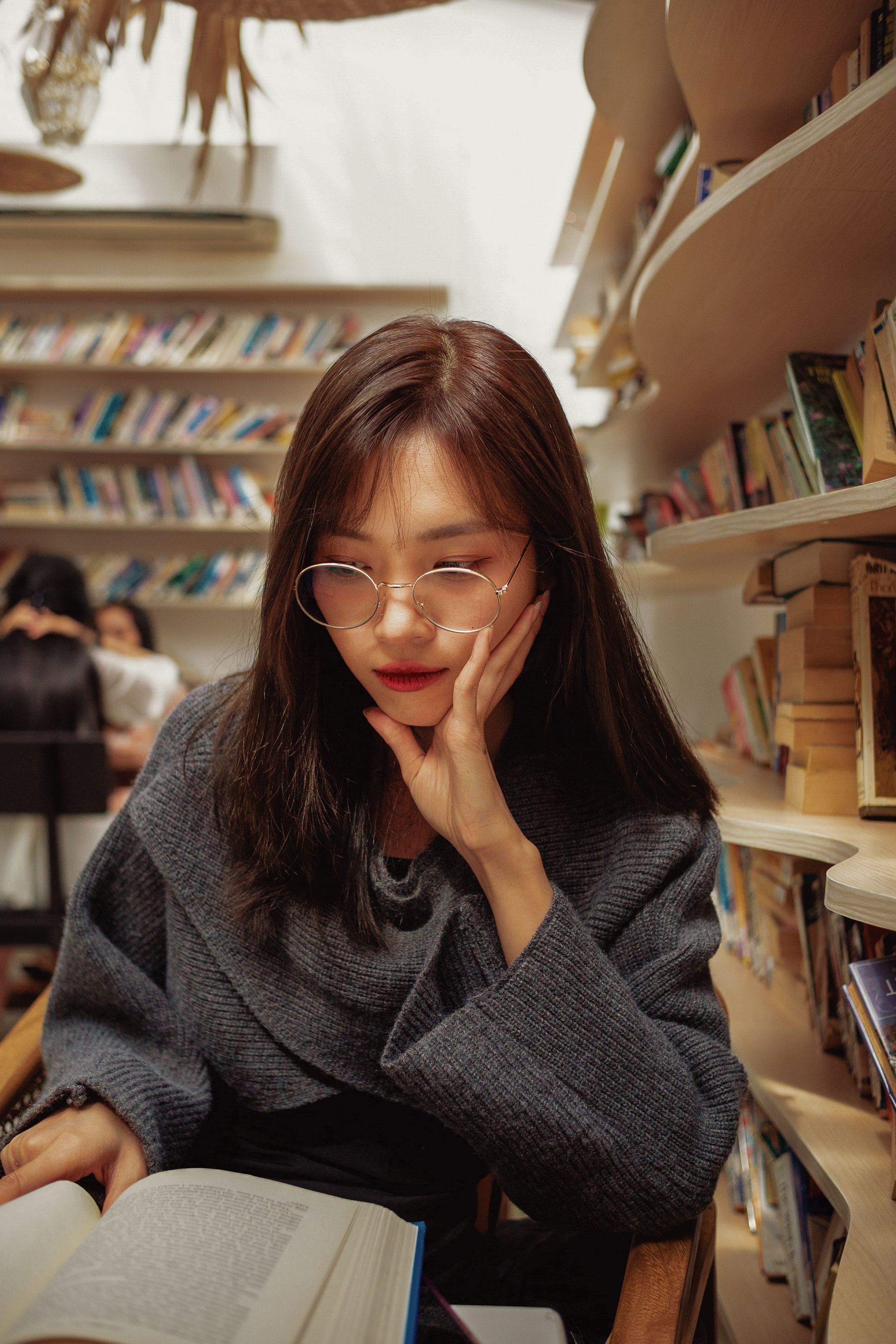 Beautiful Woman in Eyeglasses reading a Book · Free Stock Photo