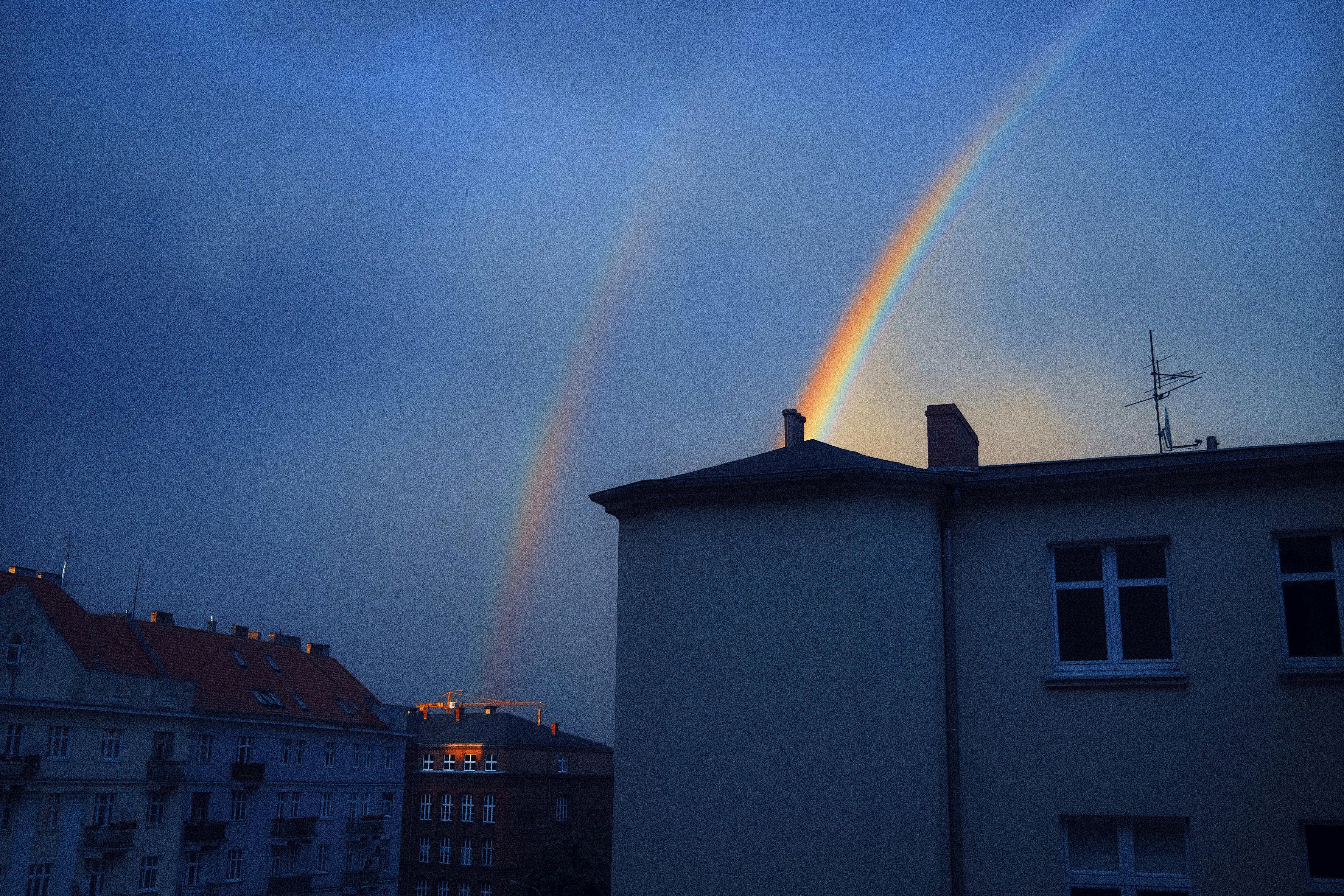 Rainbows on Sky over Buildings · Free Stock Photo