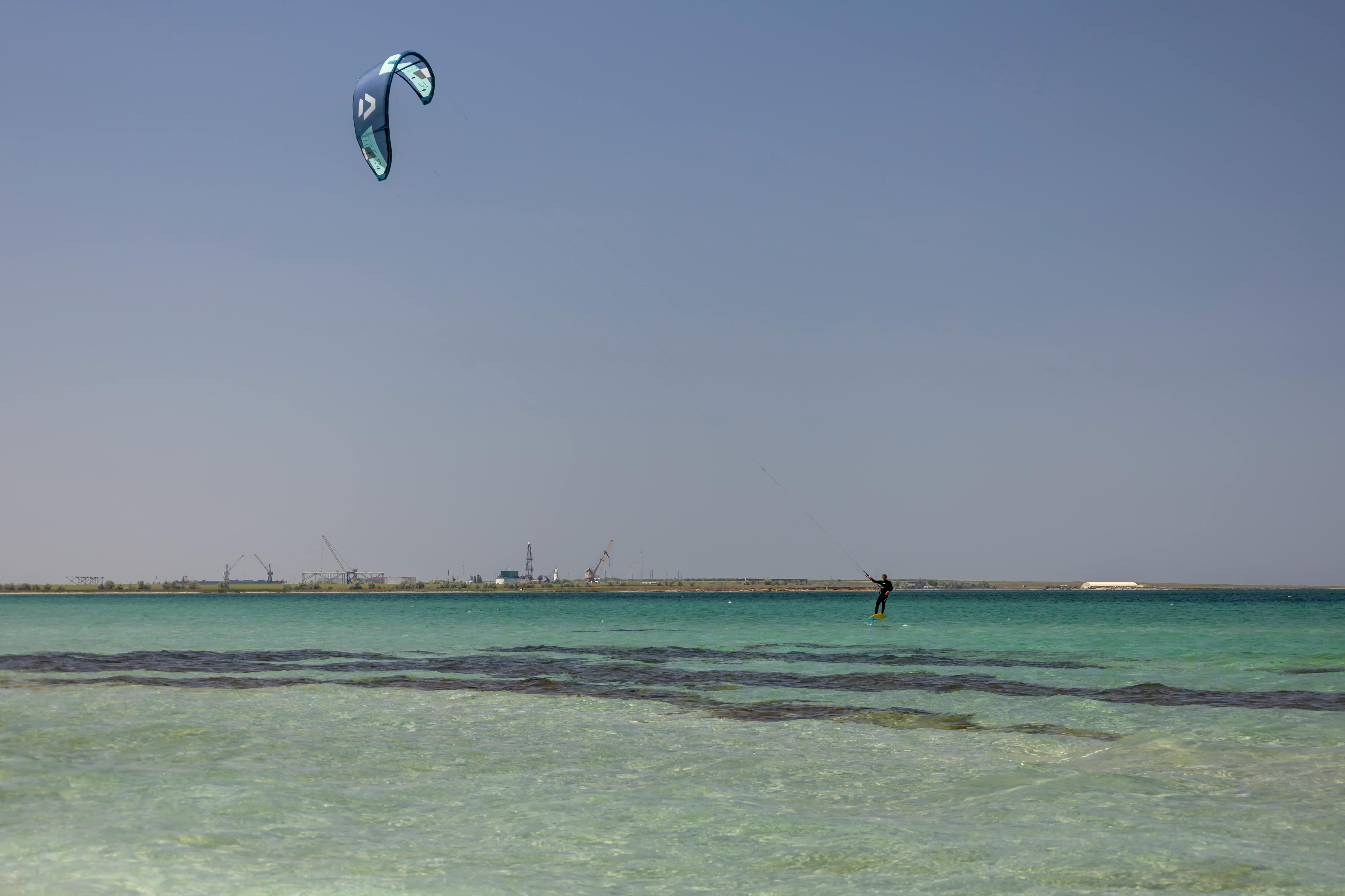 Man Wind Surfing on Sea · Free Stock Photo