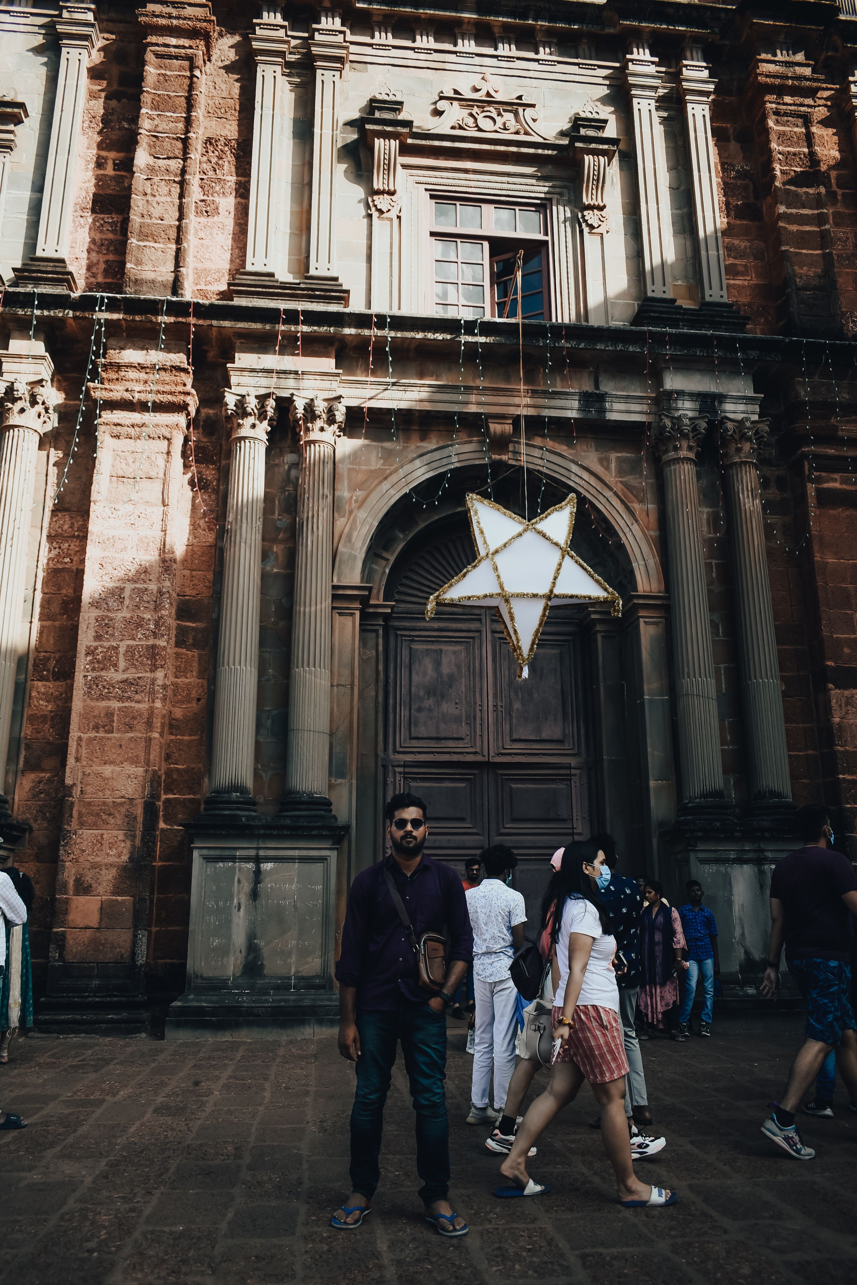 People Walking Near Old Concrete Building · Free Stock Photo