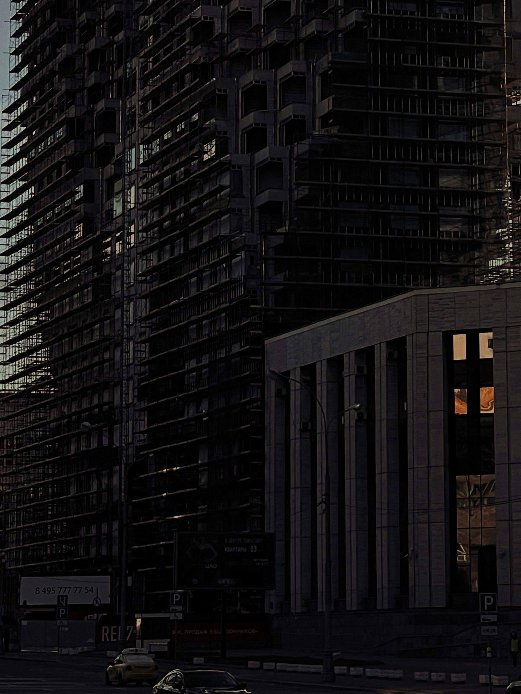 Moving Cars in the City Near Tall Buildings · Free Stock Photo