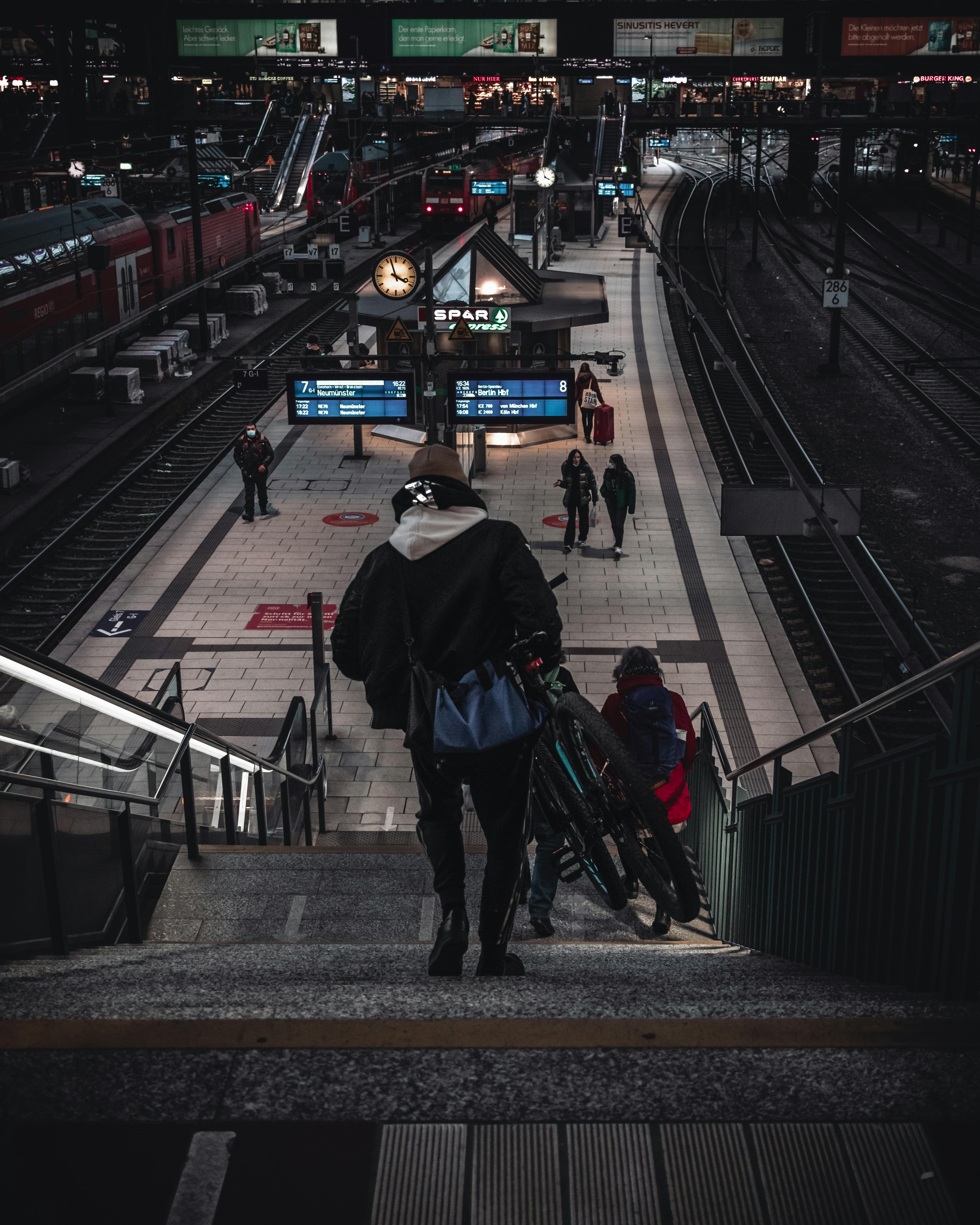 Passengers Going Down the Stairs of Train Station · Free Stock Photo