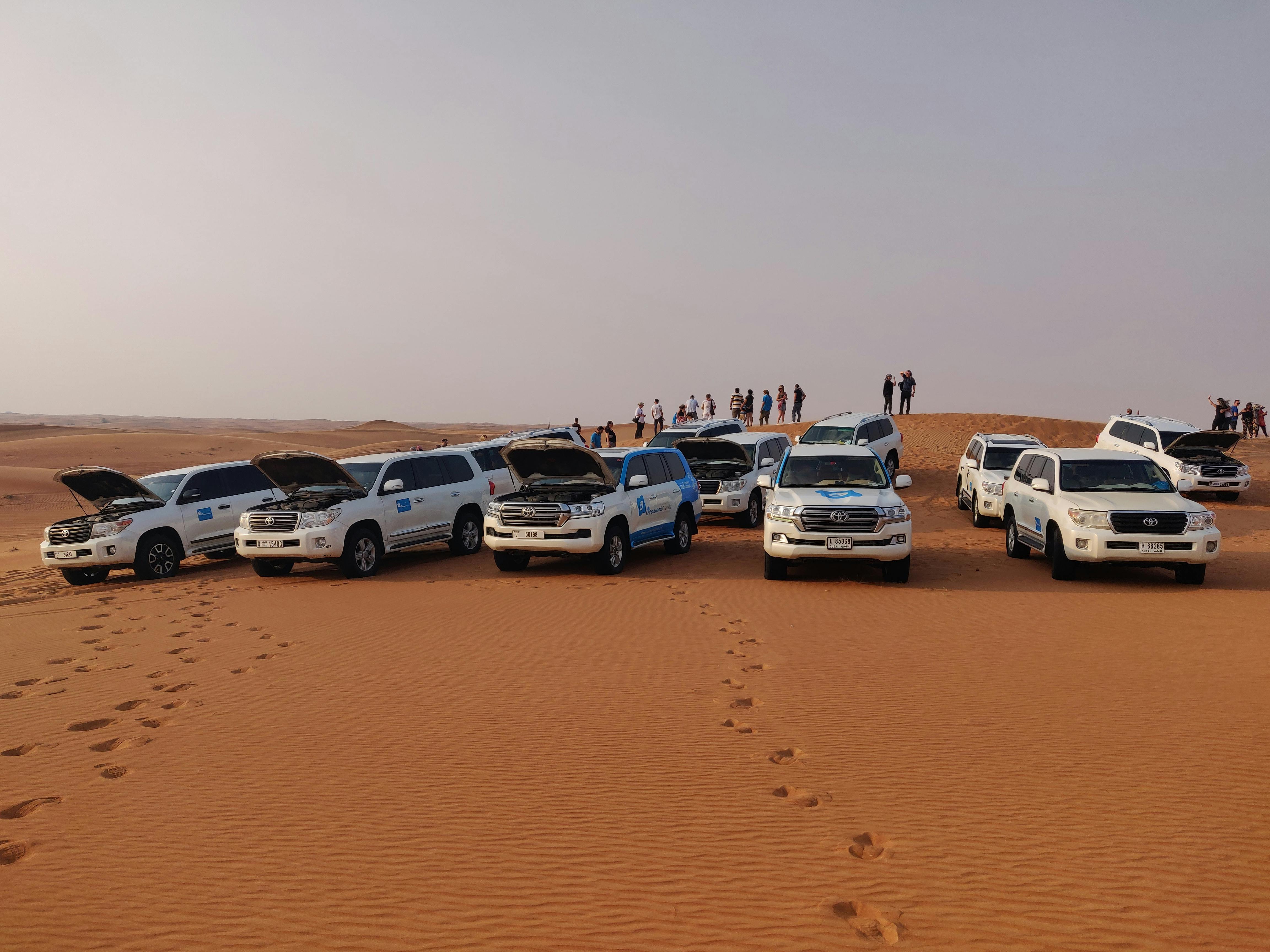 Photo of White Cars on a Desert · Free Stock Photo