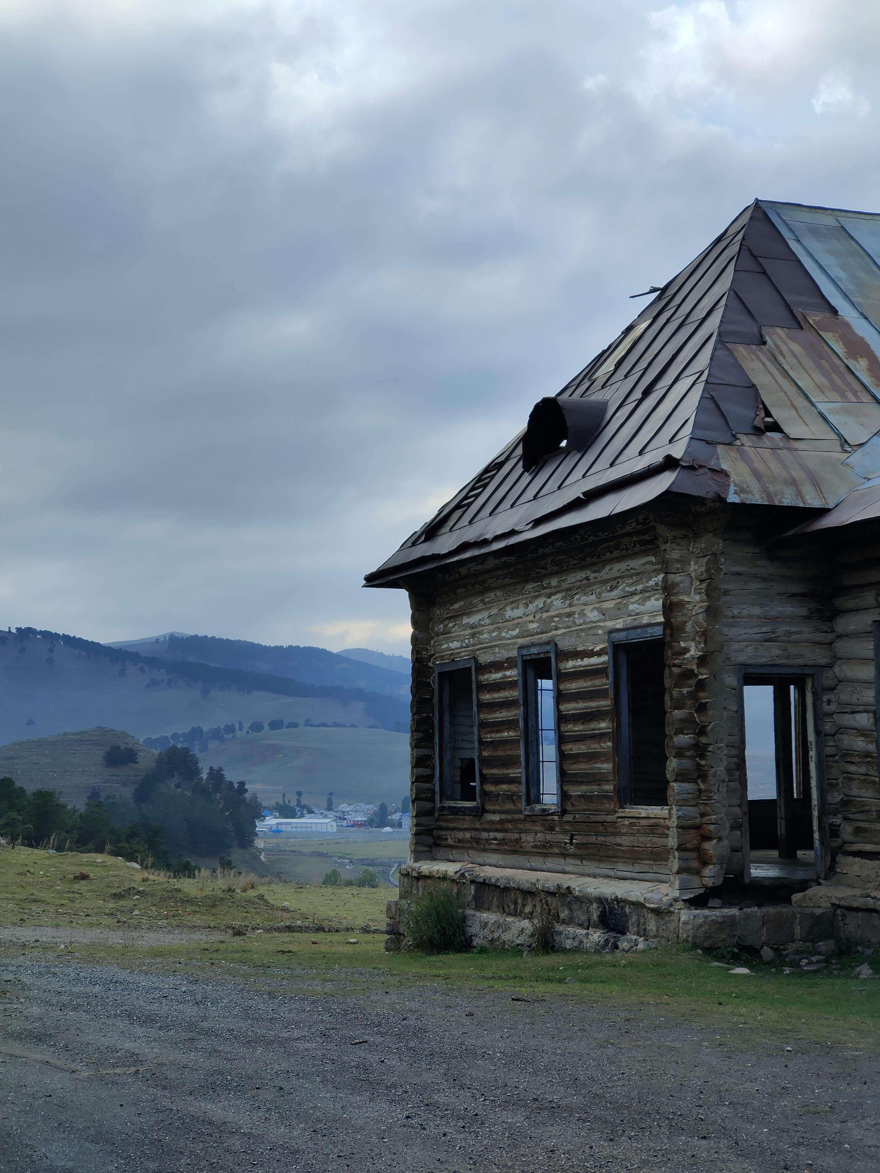A Wooden House on a Grass Field · Free Stock Photo