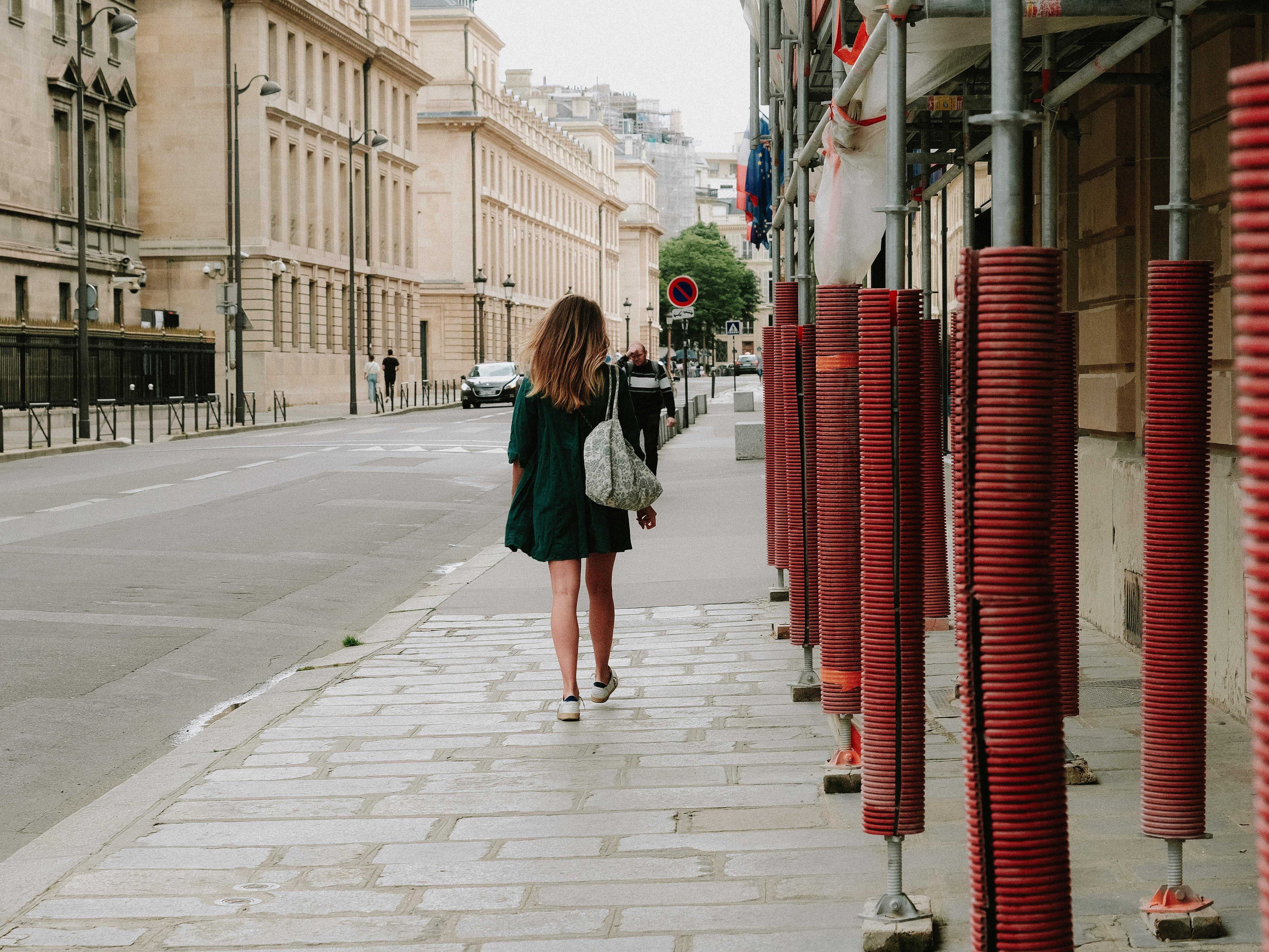 Woman Walking along City Sidewalk · Free Stock Photo