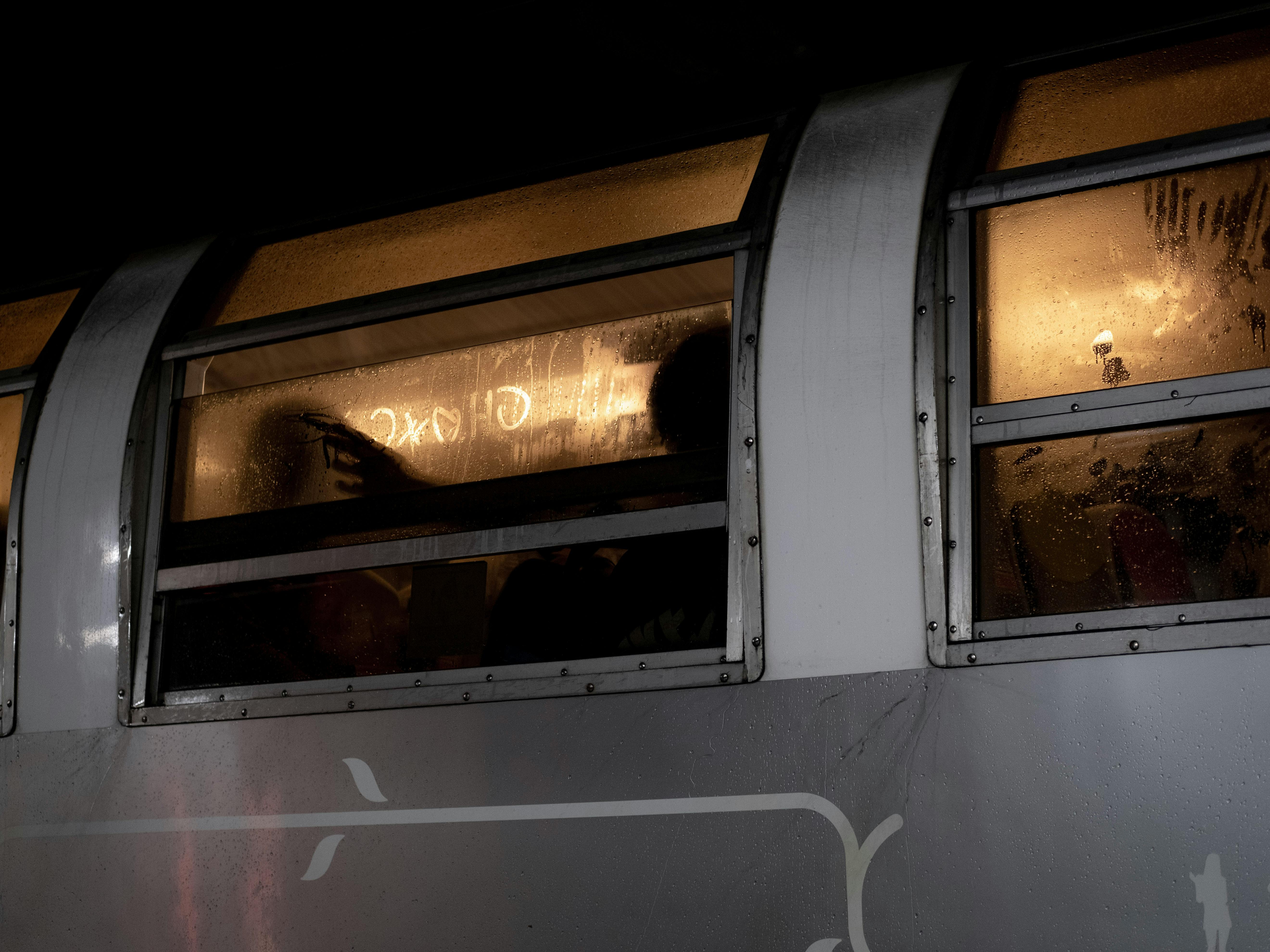 White and Black Train during Night Time · Free Stock Photo