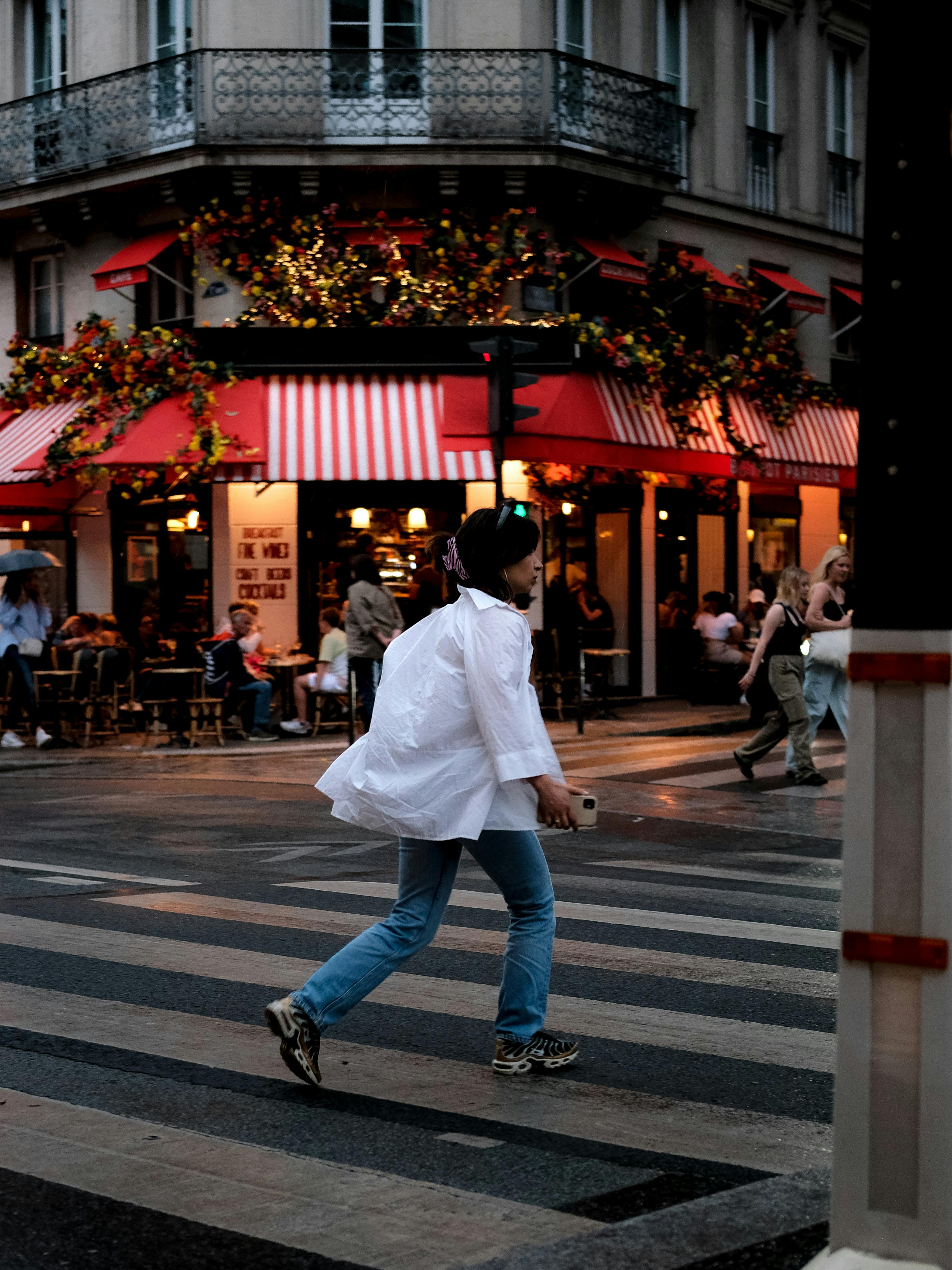 Woman Walking Along Pedestrian Lane · Free Stock Photo