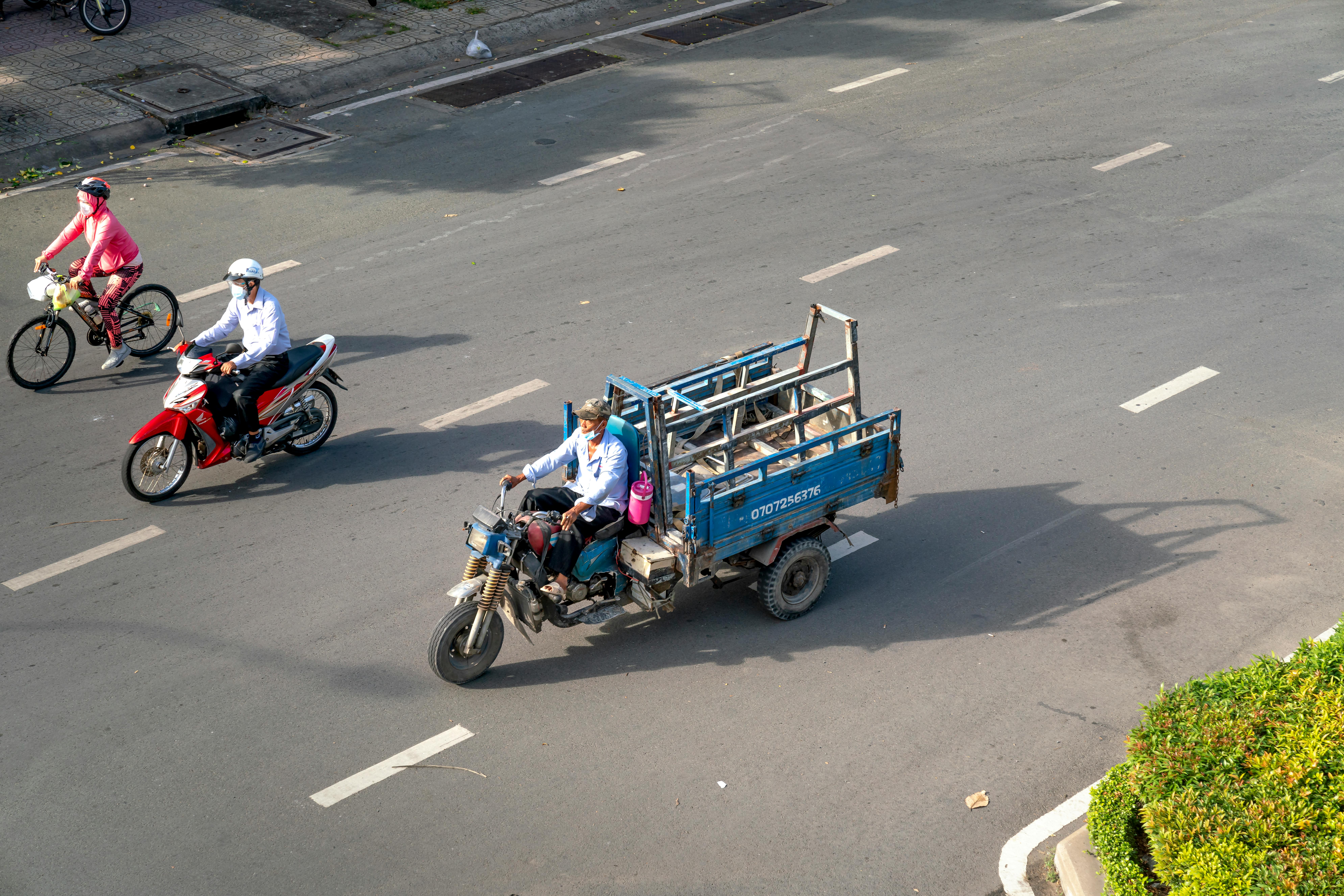 Person Riding Extremely Packed Bike · Free Stock Photo