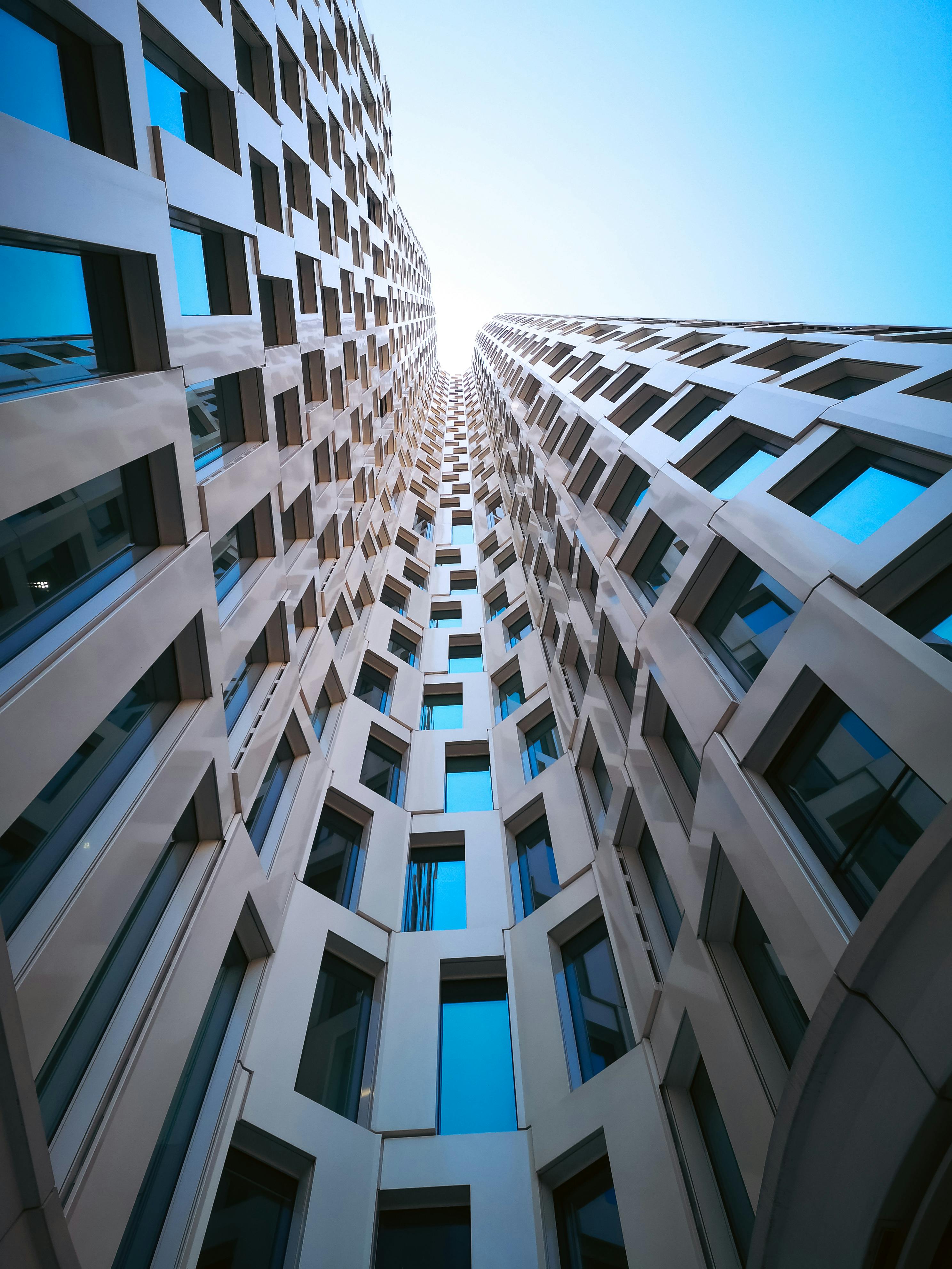 Woman Standing Next to Building · Free Stock Photo