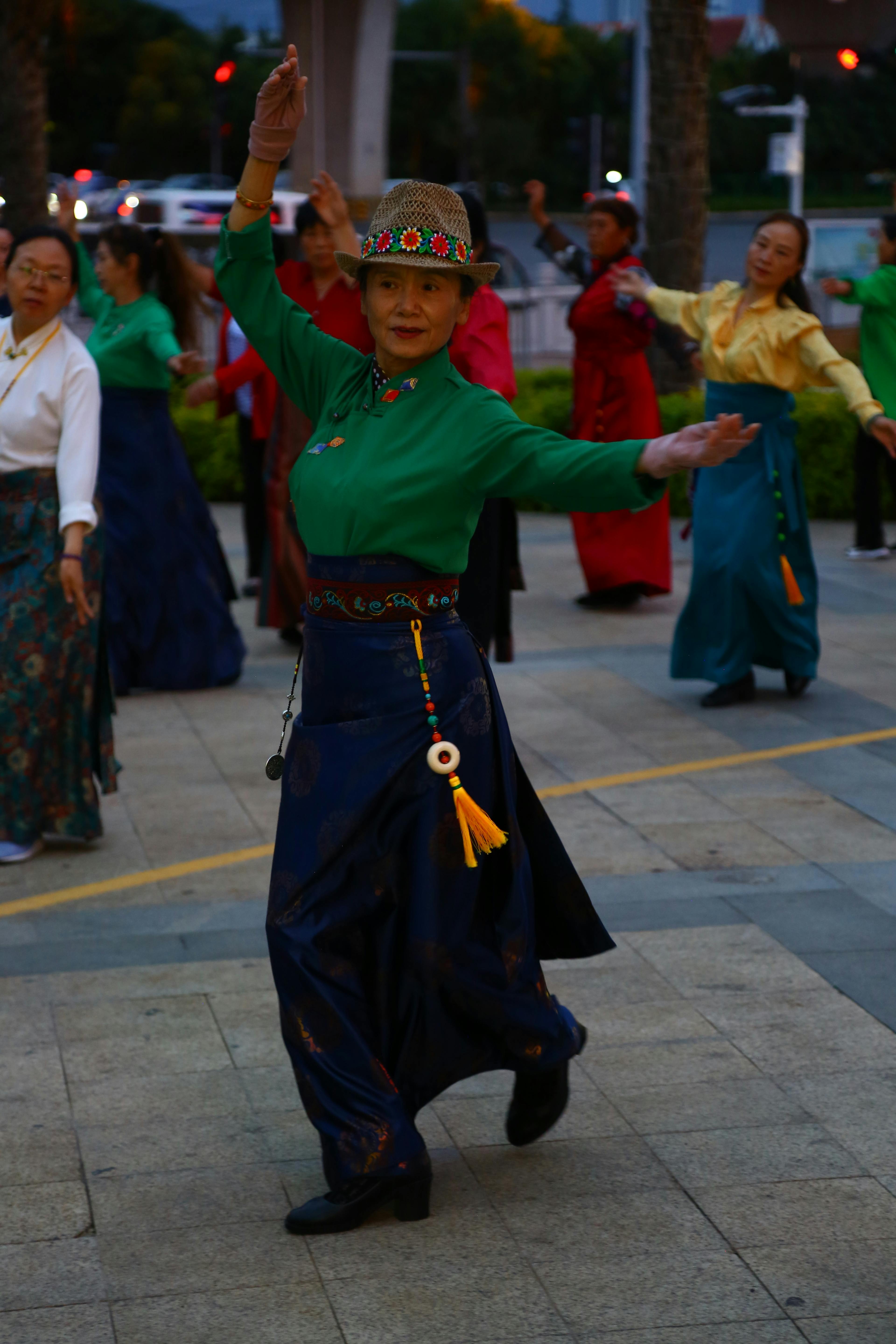 A Woman Dancing in Traditional Clothes · Free Stock Photo
