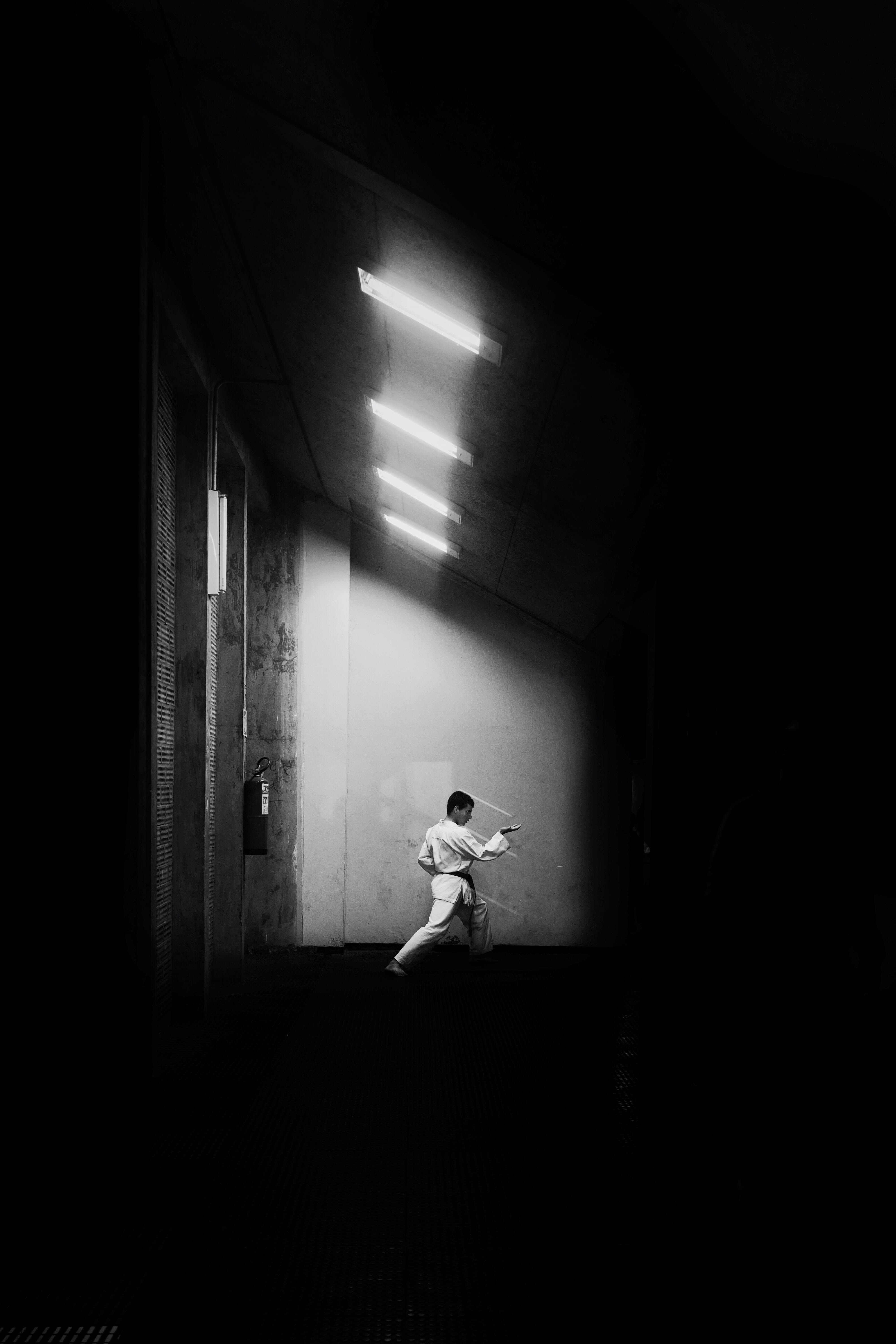 Grayscale Photo of Man doing Martial Arts · Free Stock Photo
