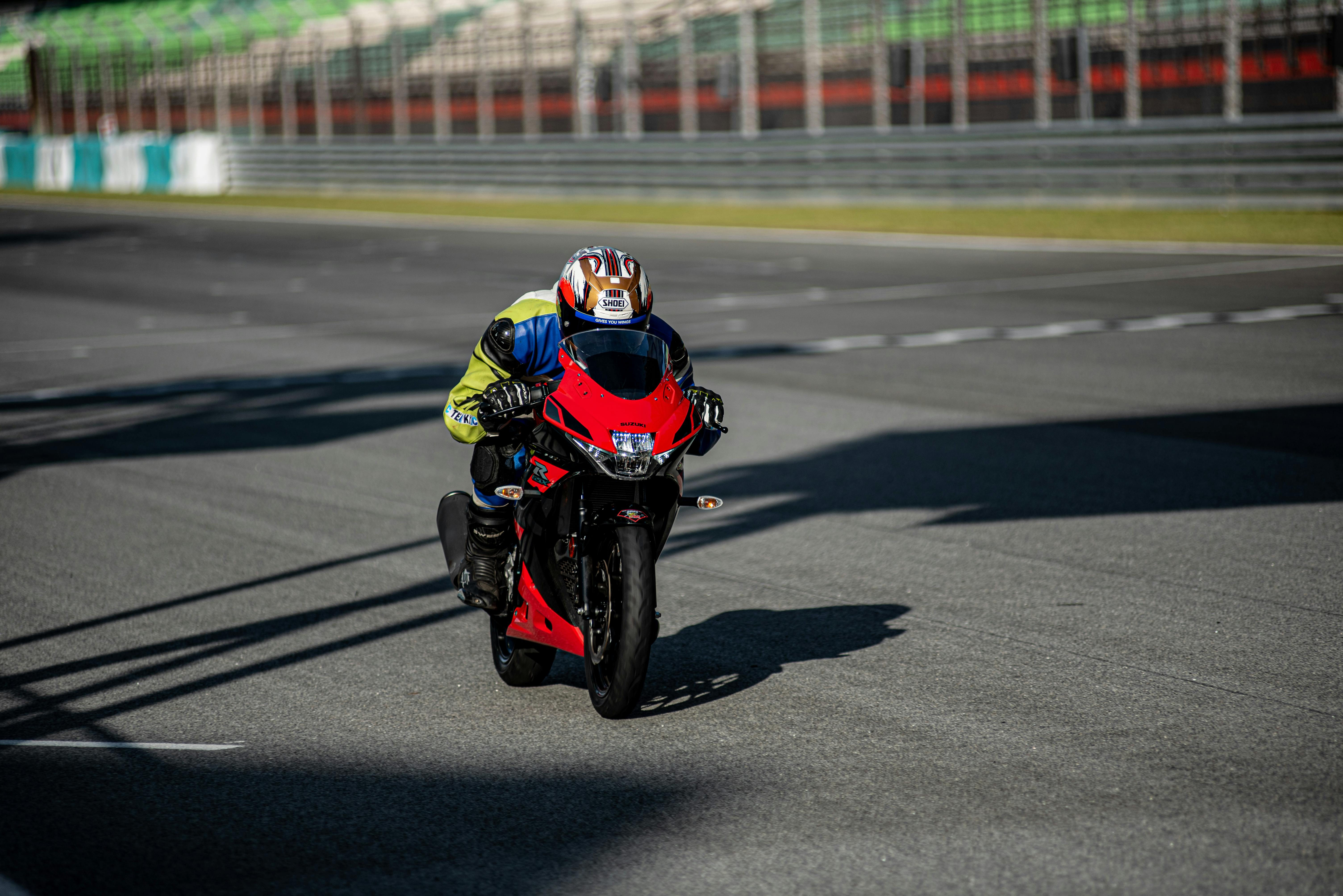 A Fast Moving Motorcycle on Race Track · Free Stock Photo