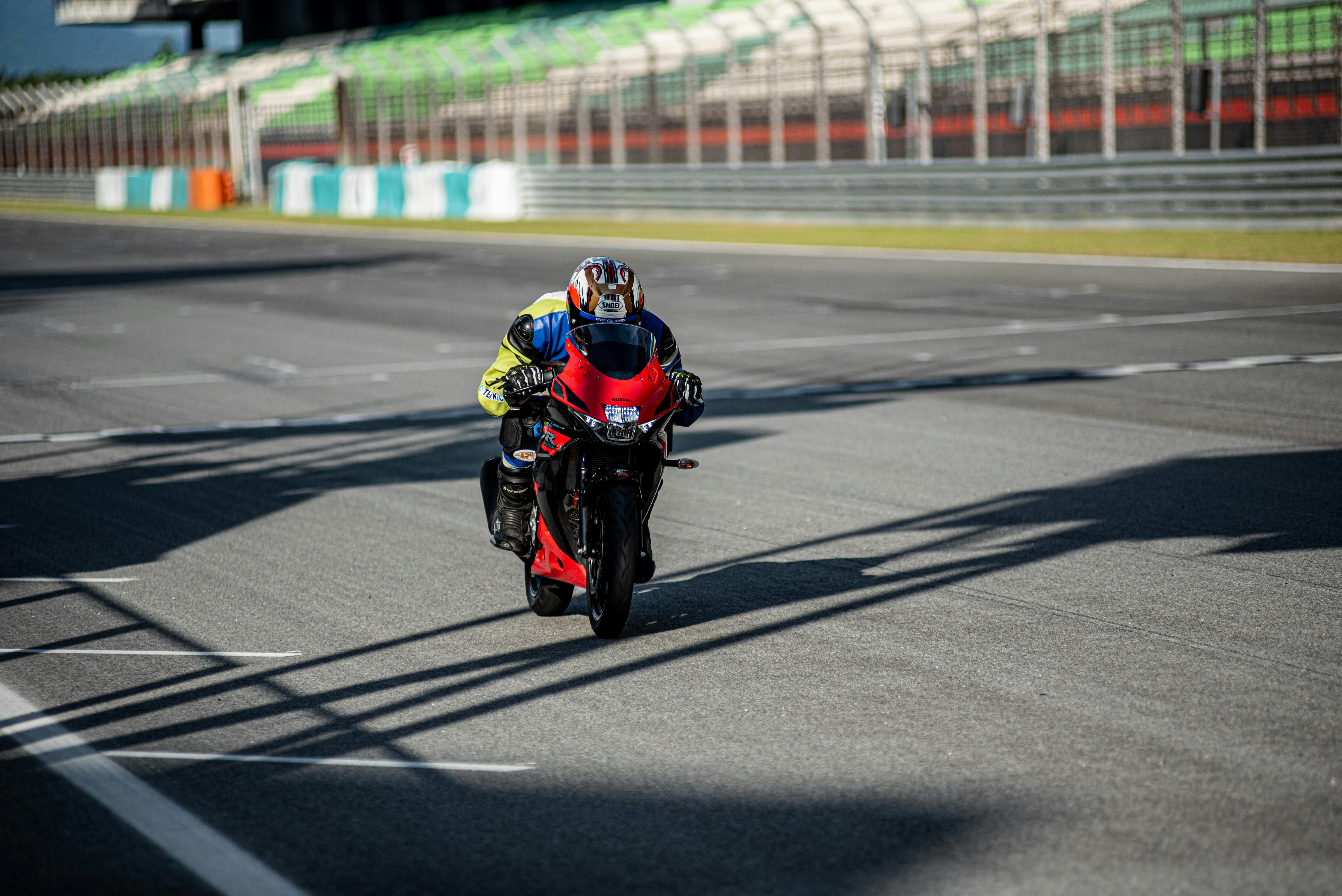 Man Riding a Red Motorcycle · Free Stock Photo