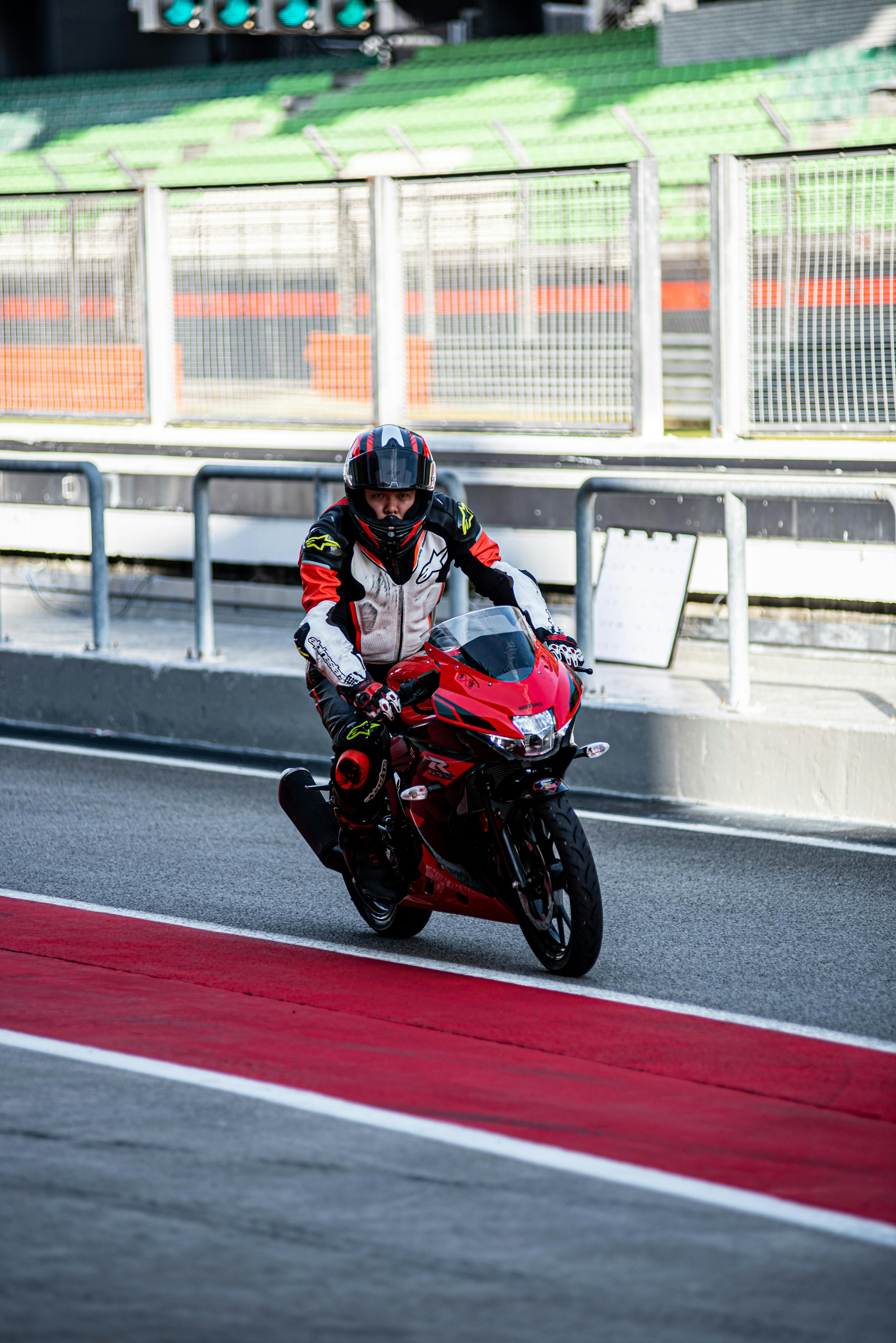 Man Riding a Red Sports Bike · Free Stock Photo