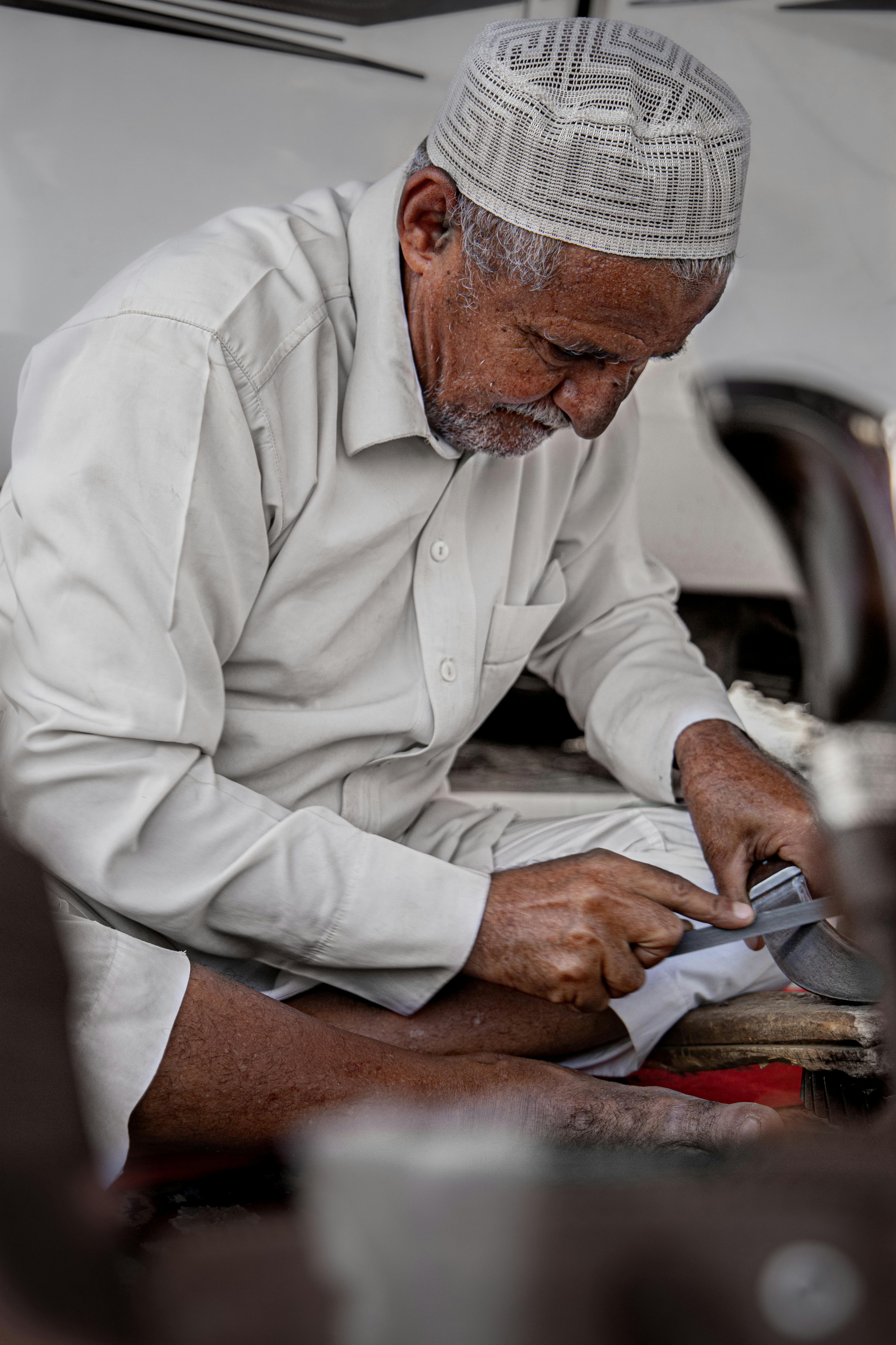 Man in Hat Working · Free Stock Photo