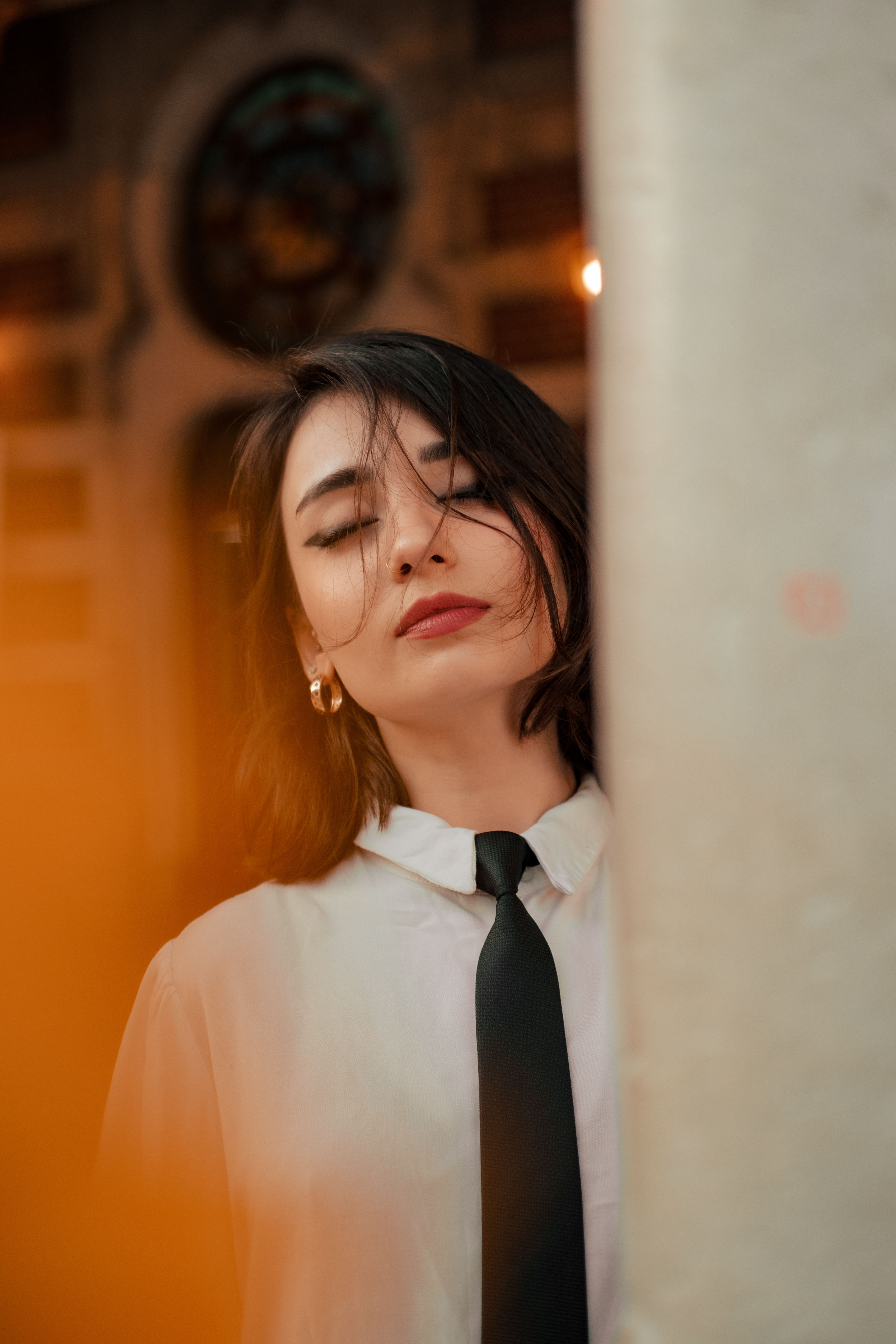 Close-Up Shot of a Pretty Woman in White Top · Free Stock Photo