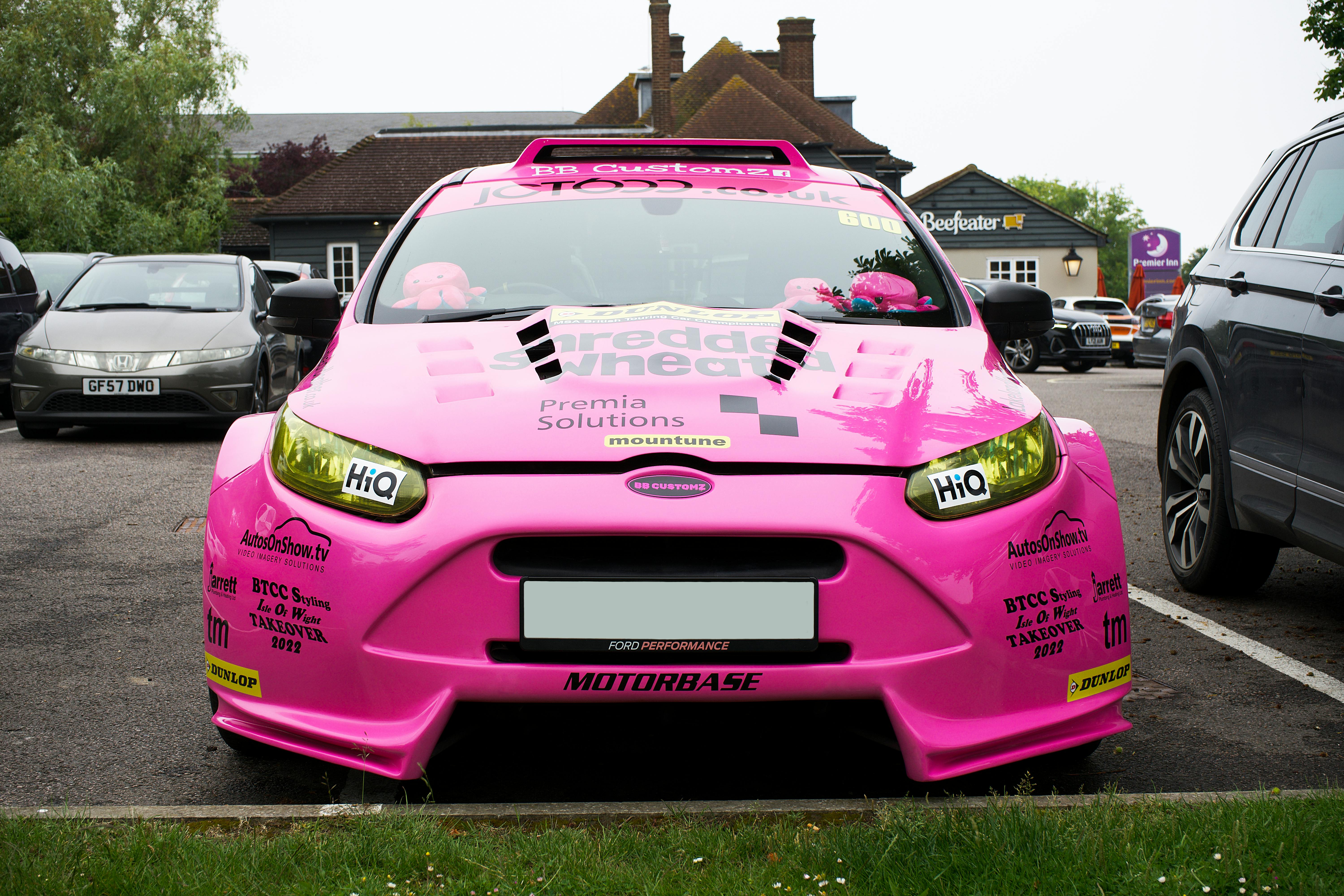 Frontage of a Pink Rally Car · Free Stock Photo
