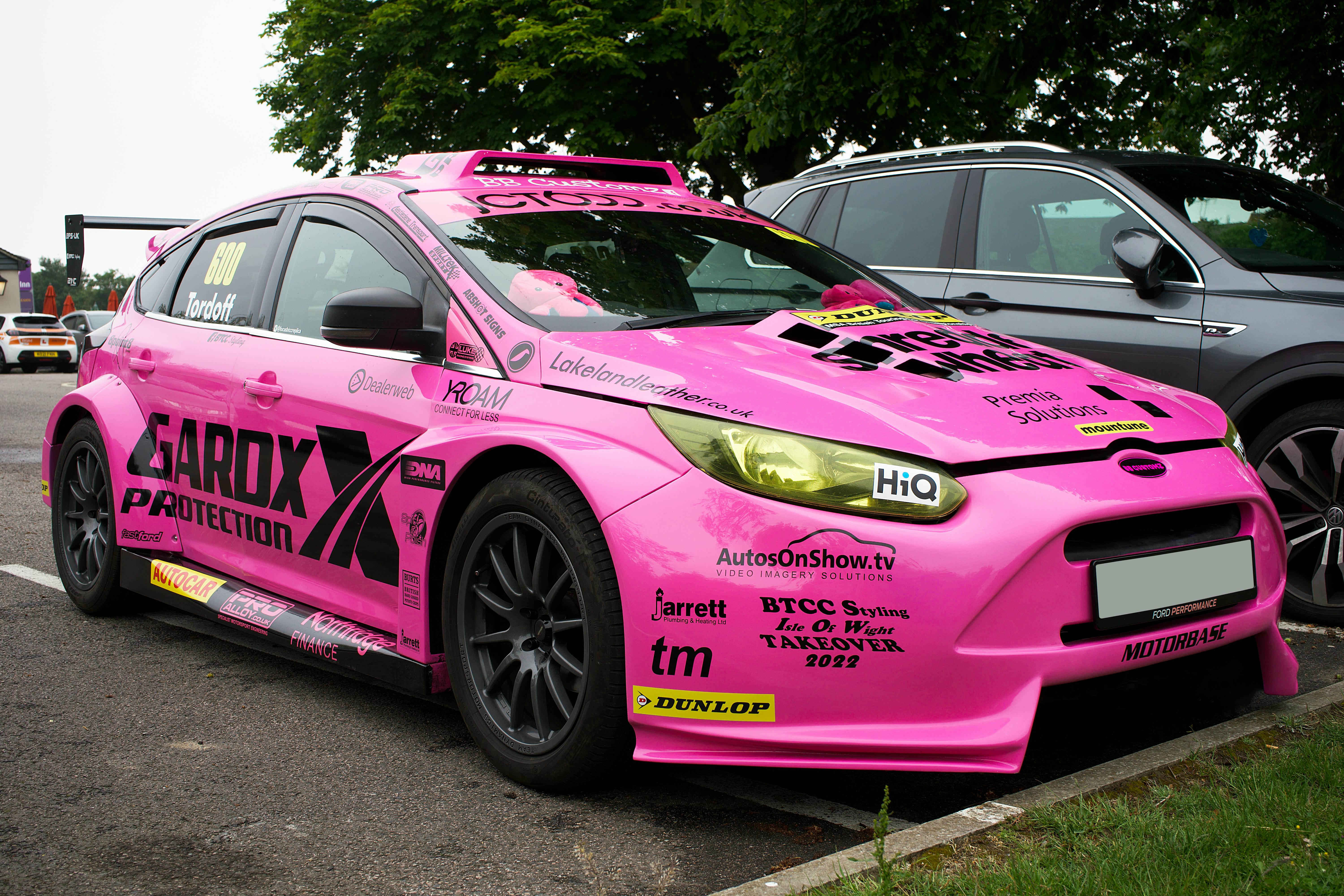 Pink Ford Focus Parked in the Parking Lot · Free Stock Photo