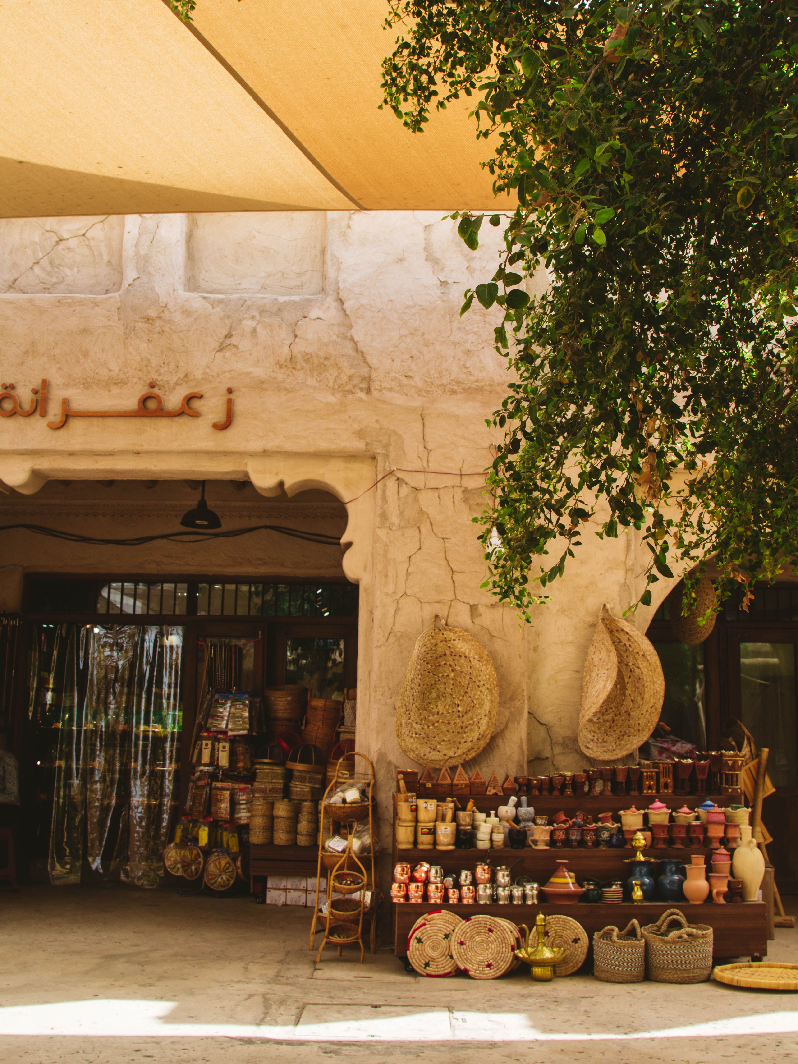 People Passing by a Souvenir Shop · Free Stock Photo