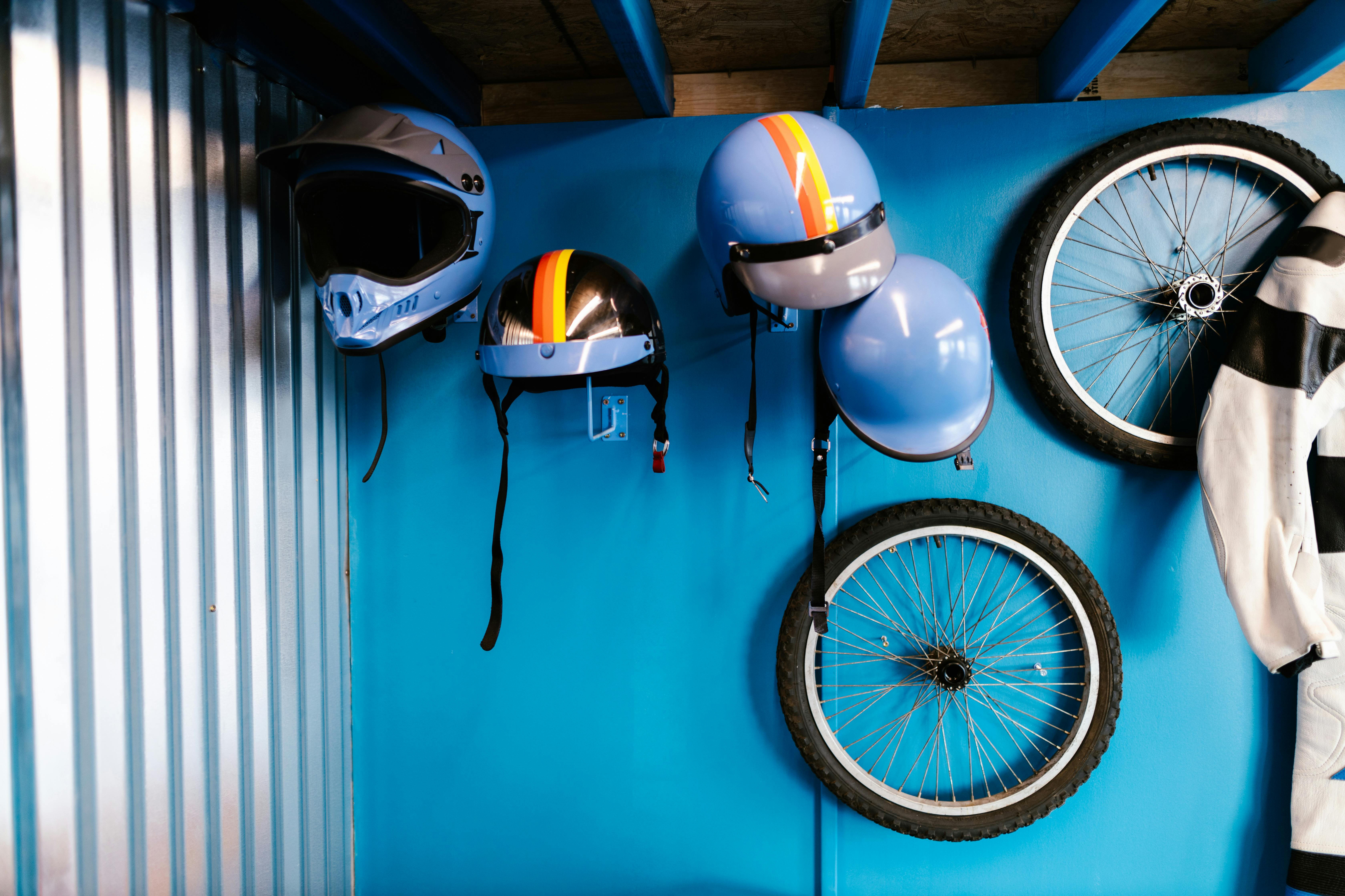Helmets and Tires on Wall · Free Stock Photo