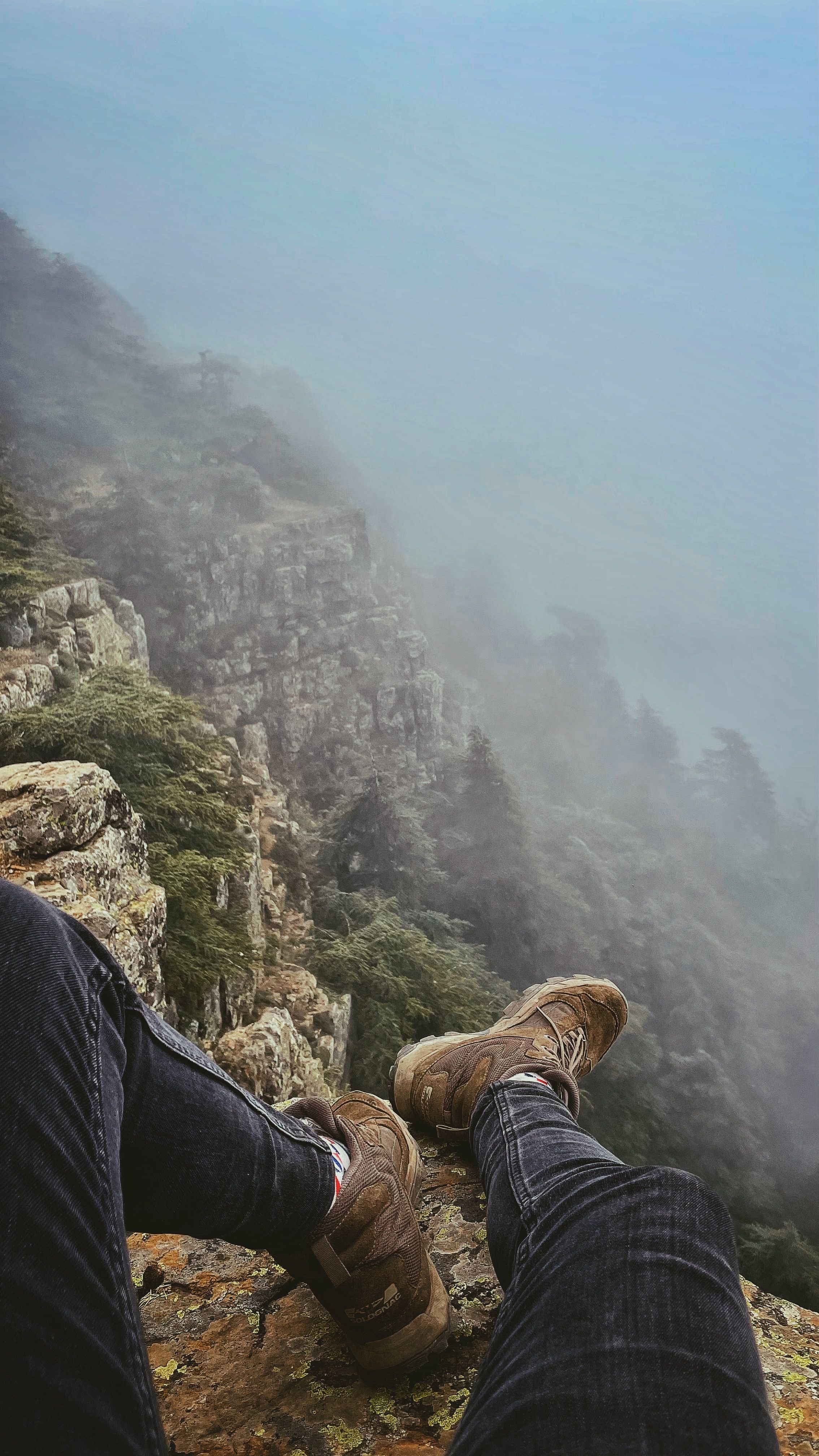 Point of View of a Person Sitting on a Cliff · Free Stock Photo