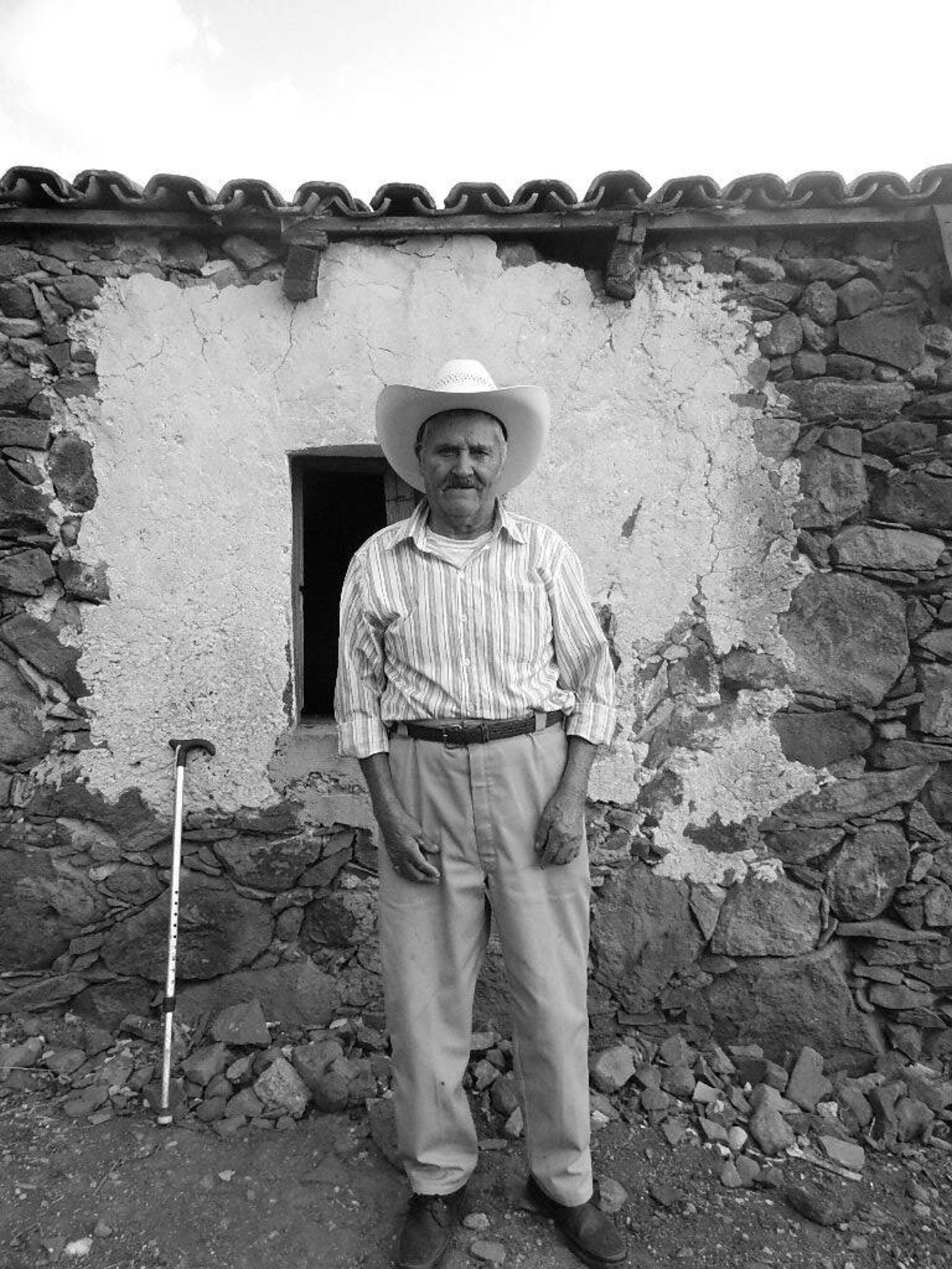Elderly Man with Hat Holding String · Free Stock Photo